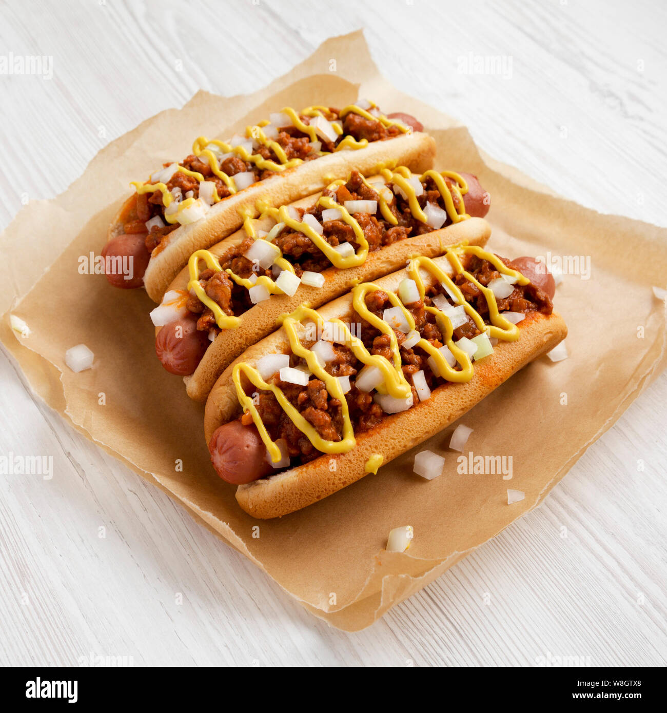 Homemade Detroit Style hot dog on parchment, side view. Close-up Stock ...