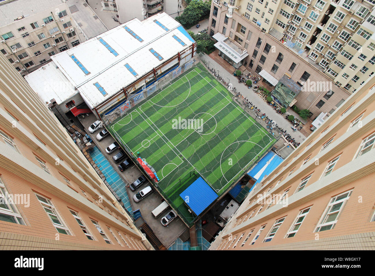 View of a football field on the rooftop of a two-story office building ...