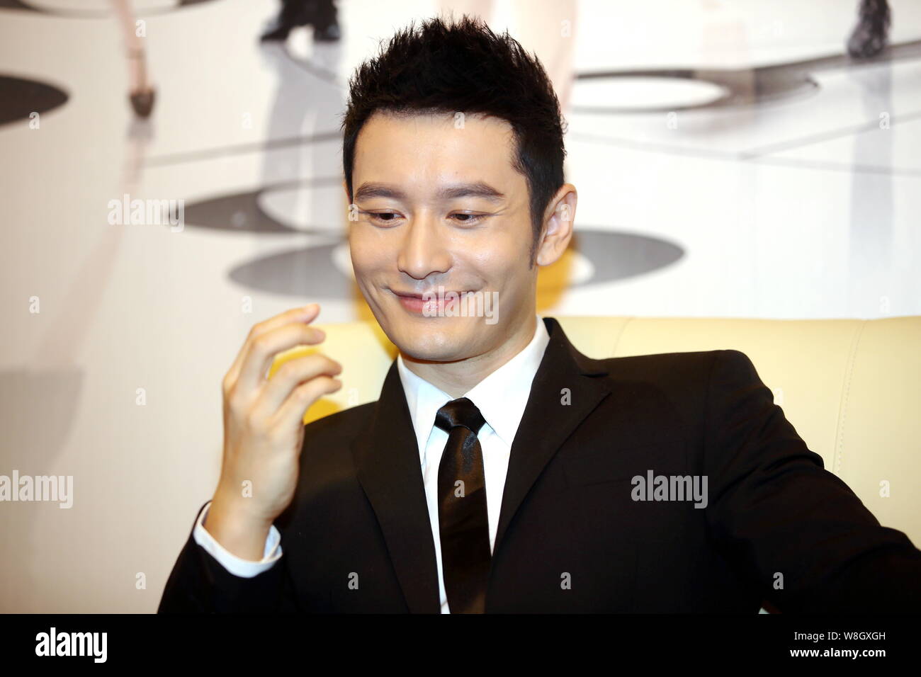 Chinese actor Huang Xiaoming smiles at a promotional event for his new ...