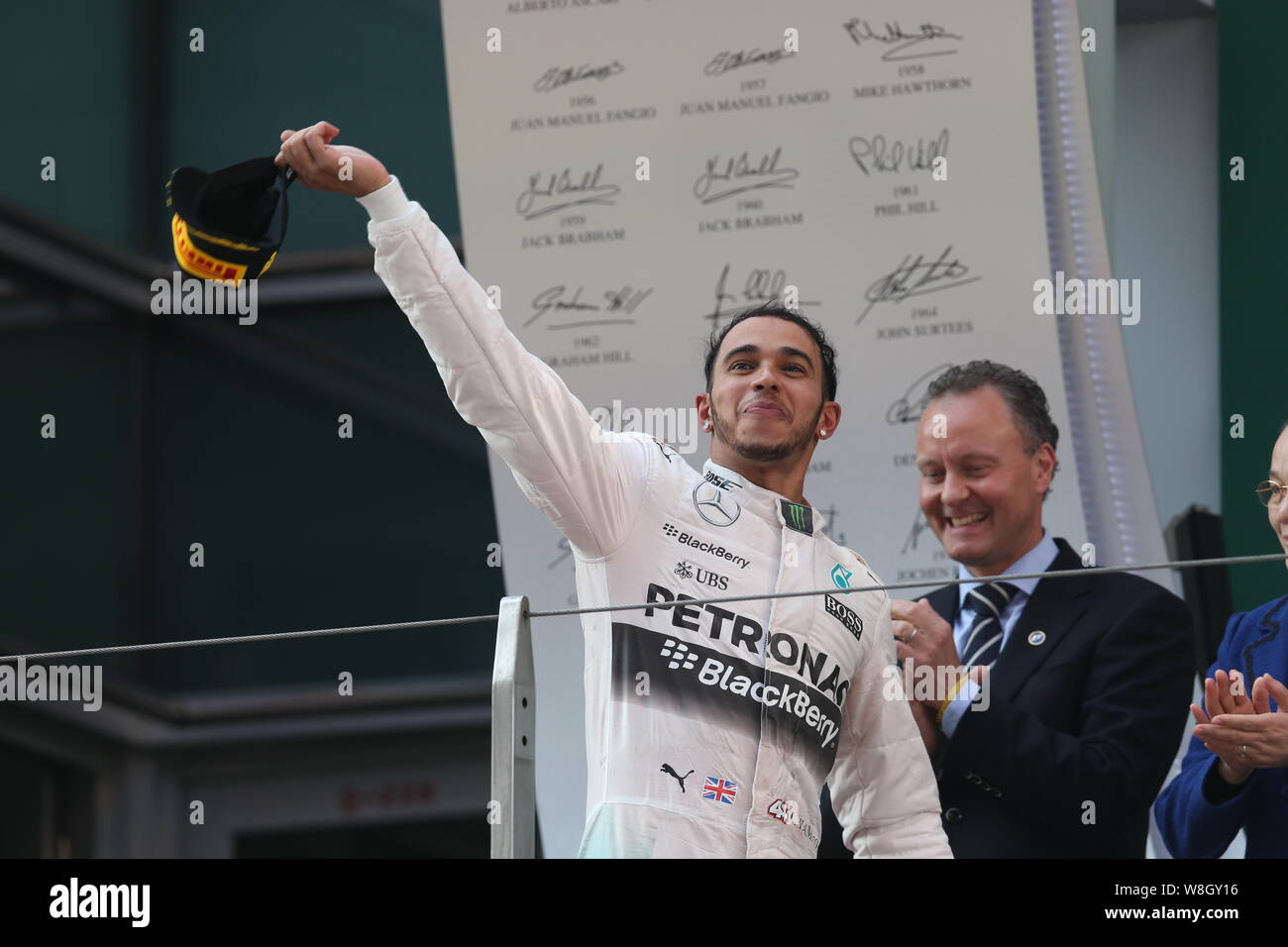 Britain's Lewis Hamilton of Mercedes, front, greets fans during the ...