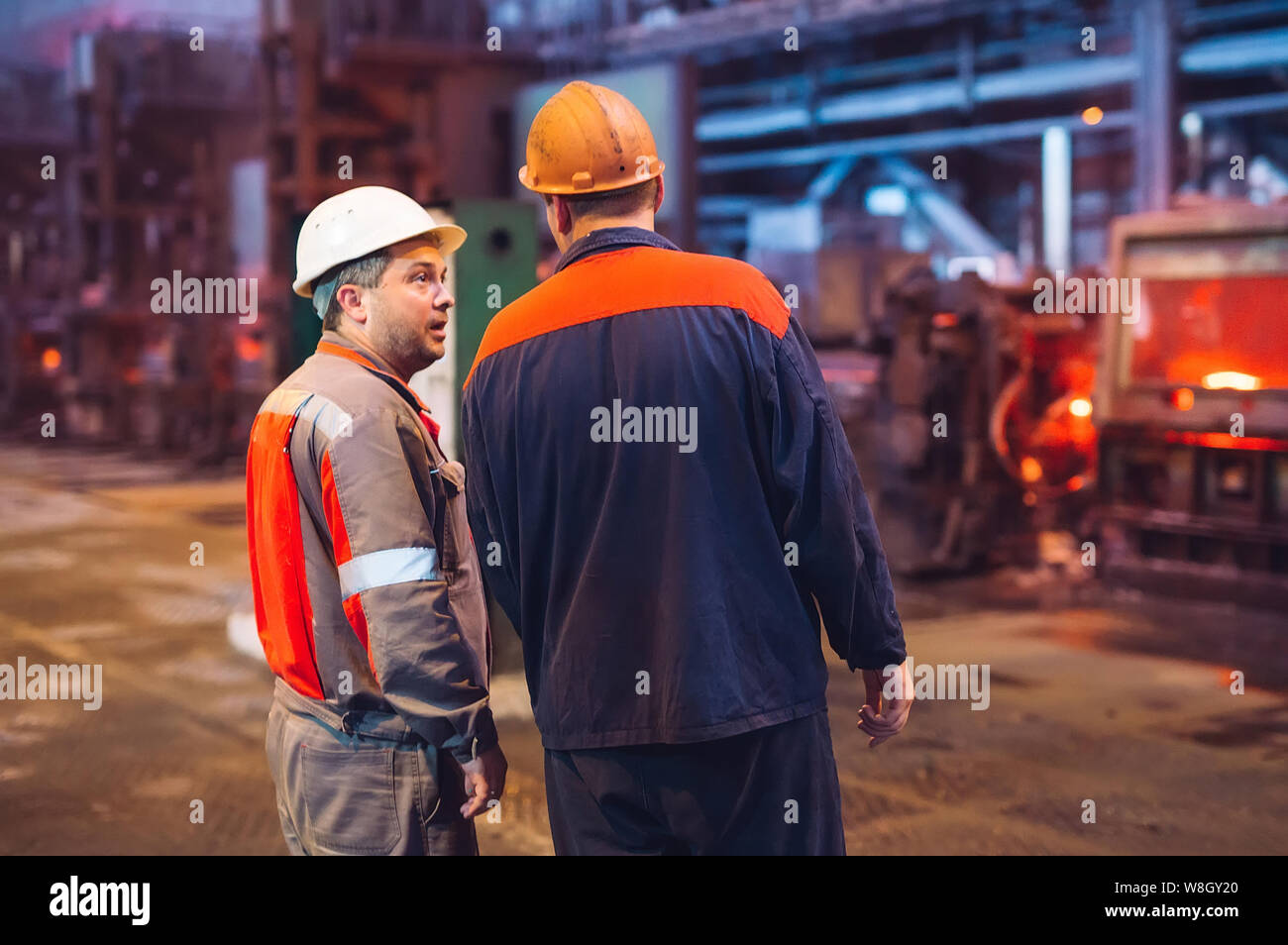 Workers in the steel mill on the metallurgical plant Stock Photo - Alamy
