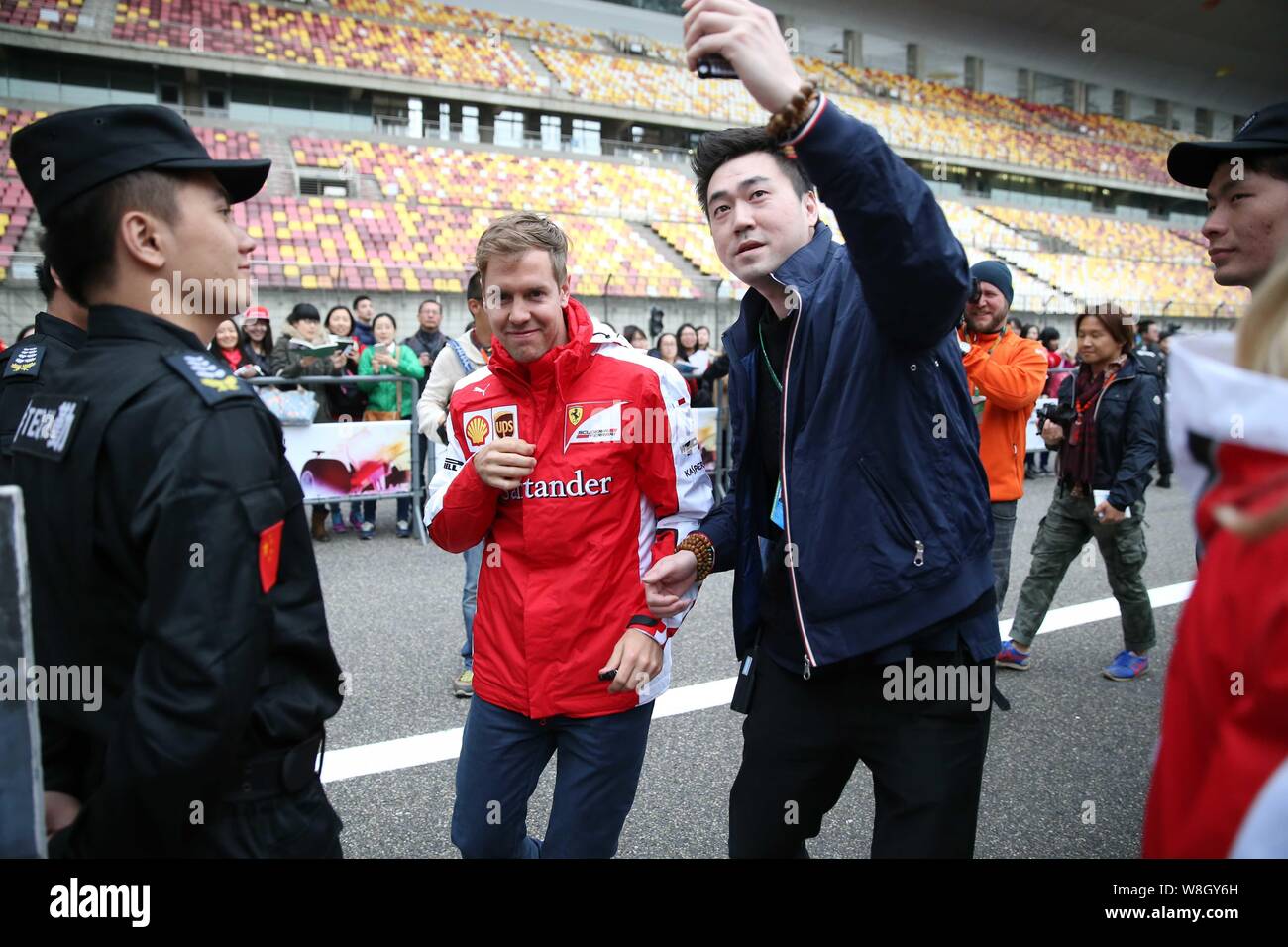 German F1 driver Sebastian Vettel of Ferrari, second left, is pictured ...