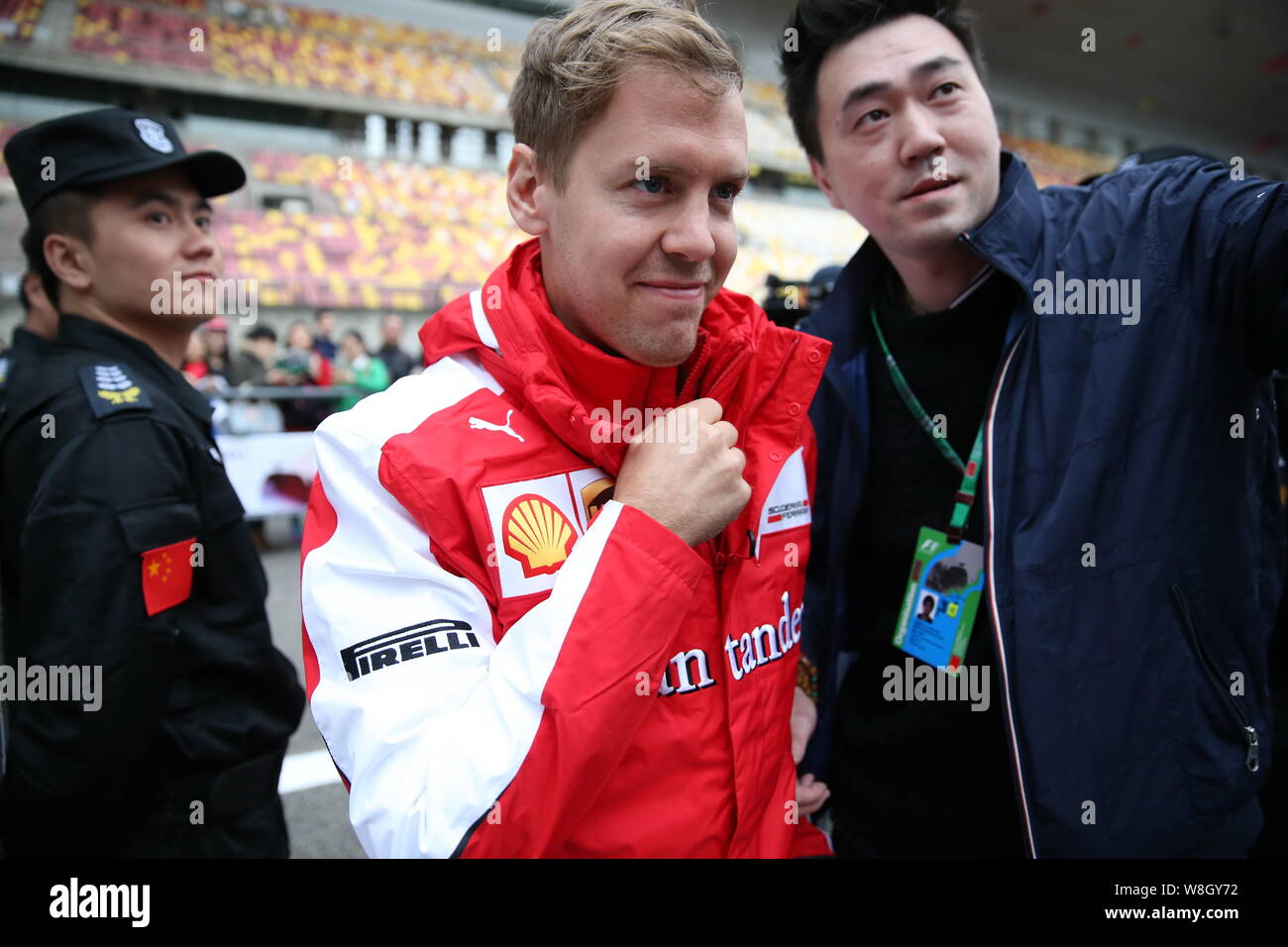 German F1 driver Sebastian Vettel of Ferrari, center, is pictured at ...