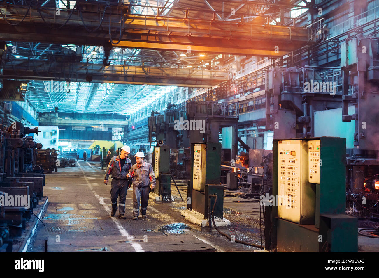 Workers in the steel mill on the metallurgical plant Stock Photo - Alamy