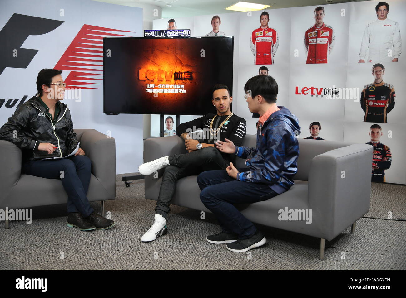 British F1 driver Lewis Hamilton of Mercedes AMG, center, attends an ...