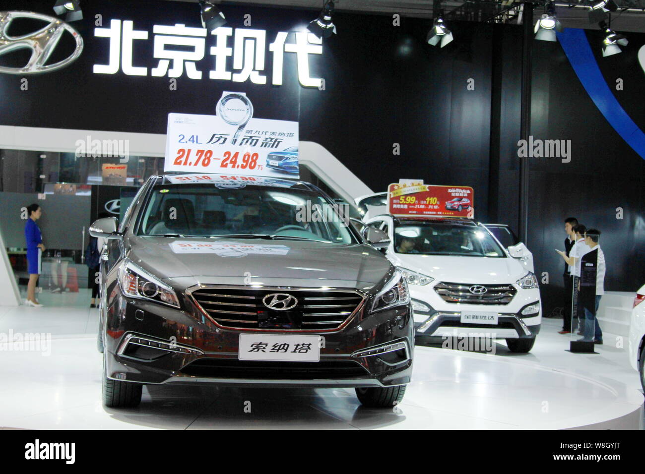 --FILE--Visitors look at Hyundai cars on display during an auto show in ...
