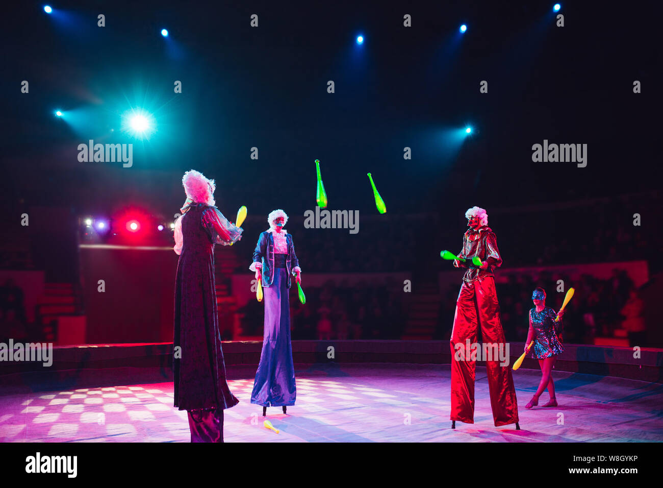 The performance of stilt-walkers in the circus Stock Photo - Alamy