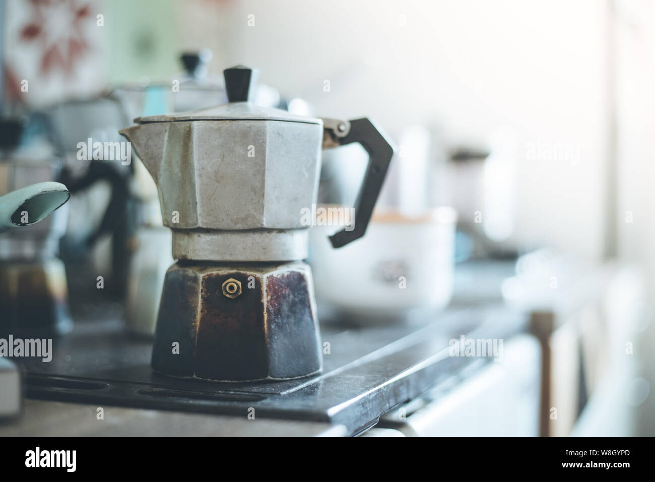 Italian coffee cooker on hot vintage stove, breakfast Stock Photo - Alamy