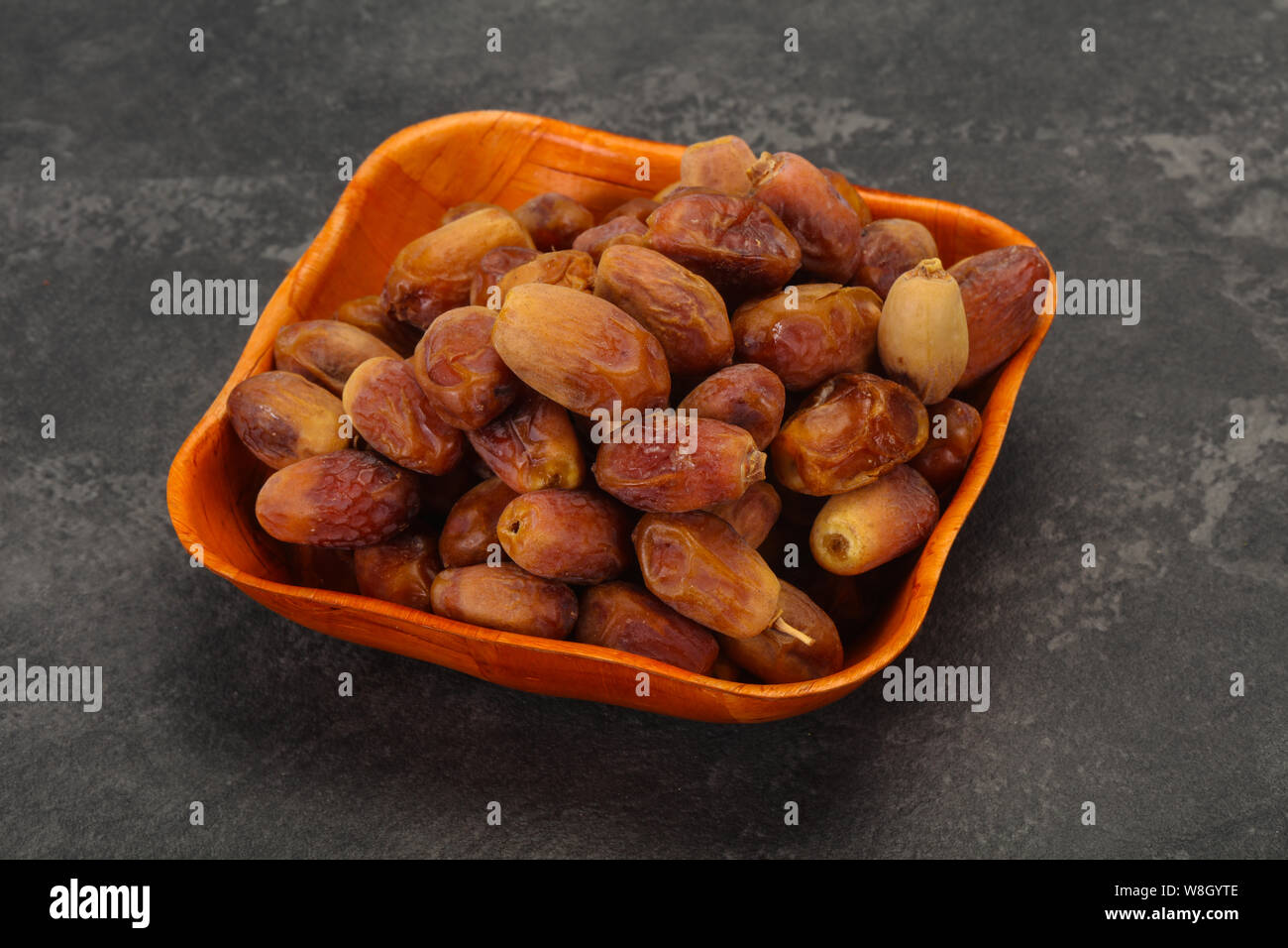Sweet tasty dry dates dessert in the basket Stock Photo - Alamy