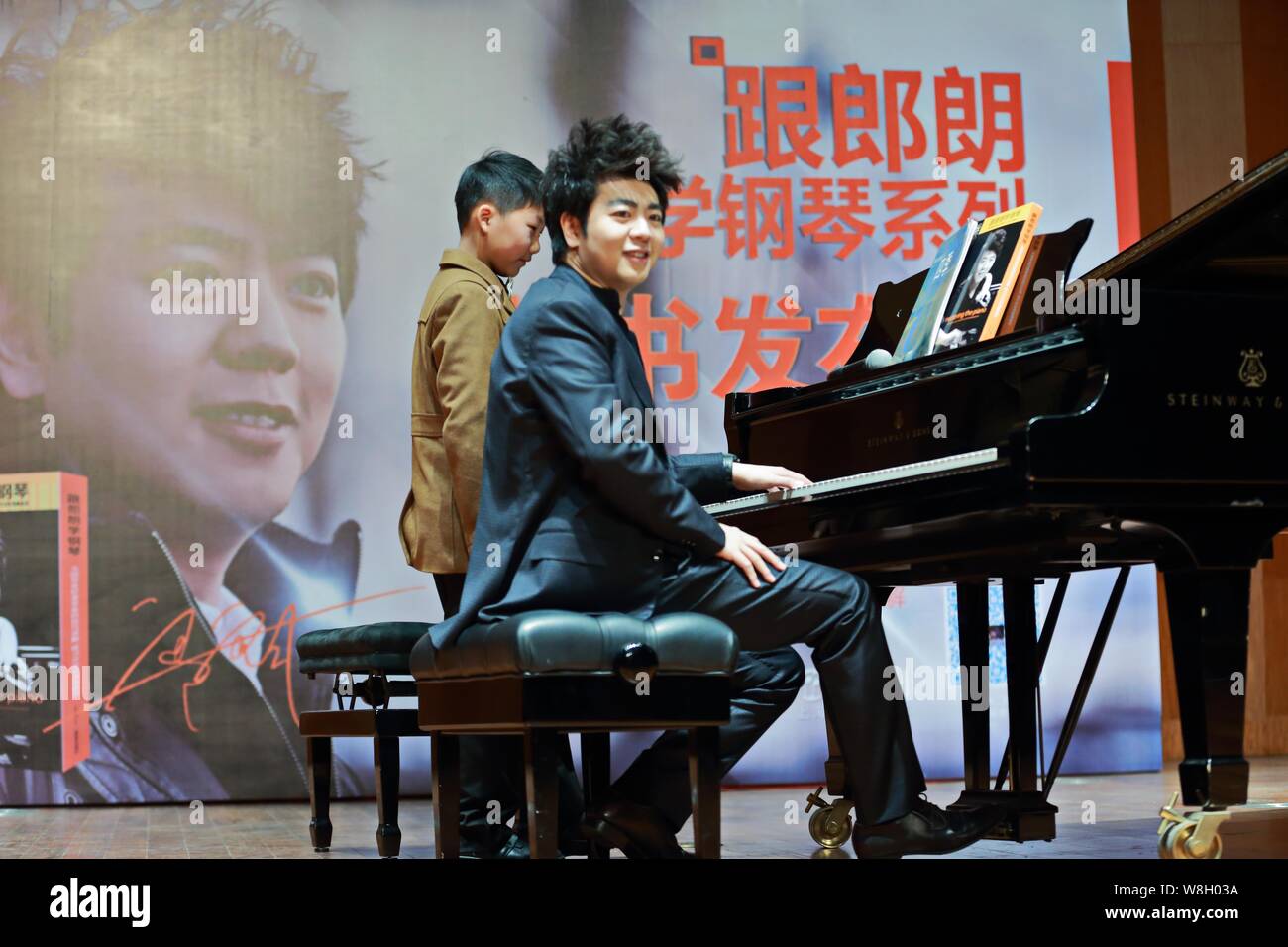 Chinese pianist Lang Lang, front, poses at a press conference for his ...