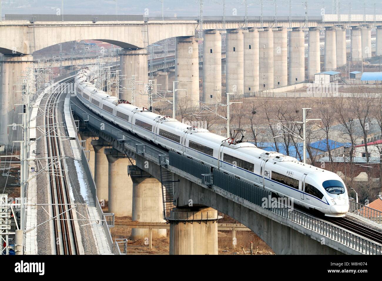--FILE--A CRH (China Railway High-speed) bullet train passes through ...