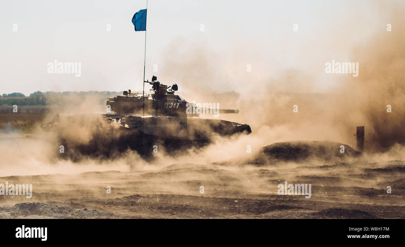 Armored Tank rides on off-road. Tank exercises in the countryside Stock ...