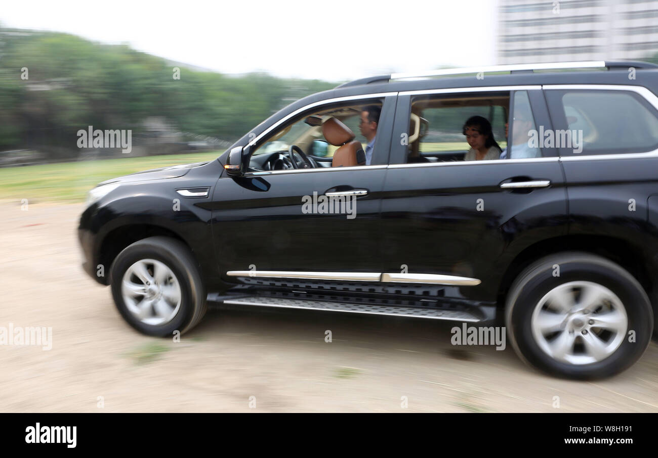 Team members test a mind-controlled car at Nankai University in Tianjin ...