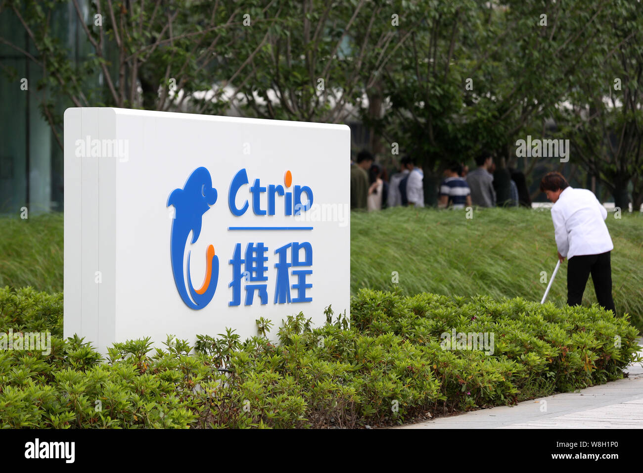 --FILE--A cleaning worker cleans up the ground at the headquarters of ...