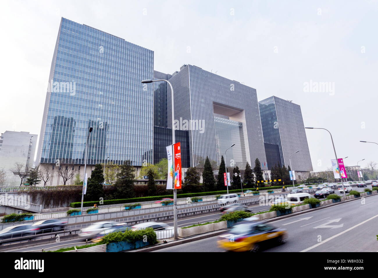 --FILE--Cars pass by the headquarters building of CNPC (China National ...