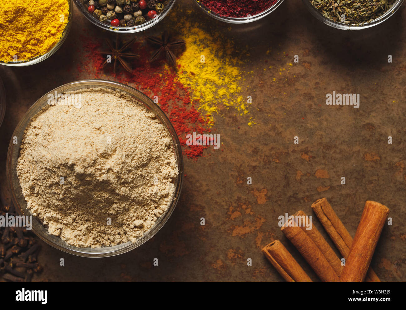 Ground Ginger . Place for text. Different types of Spices in a bowl on ...