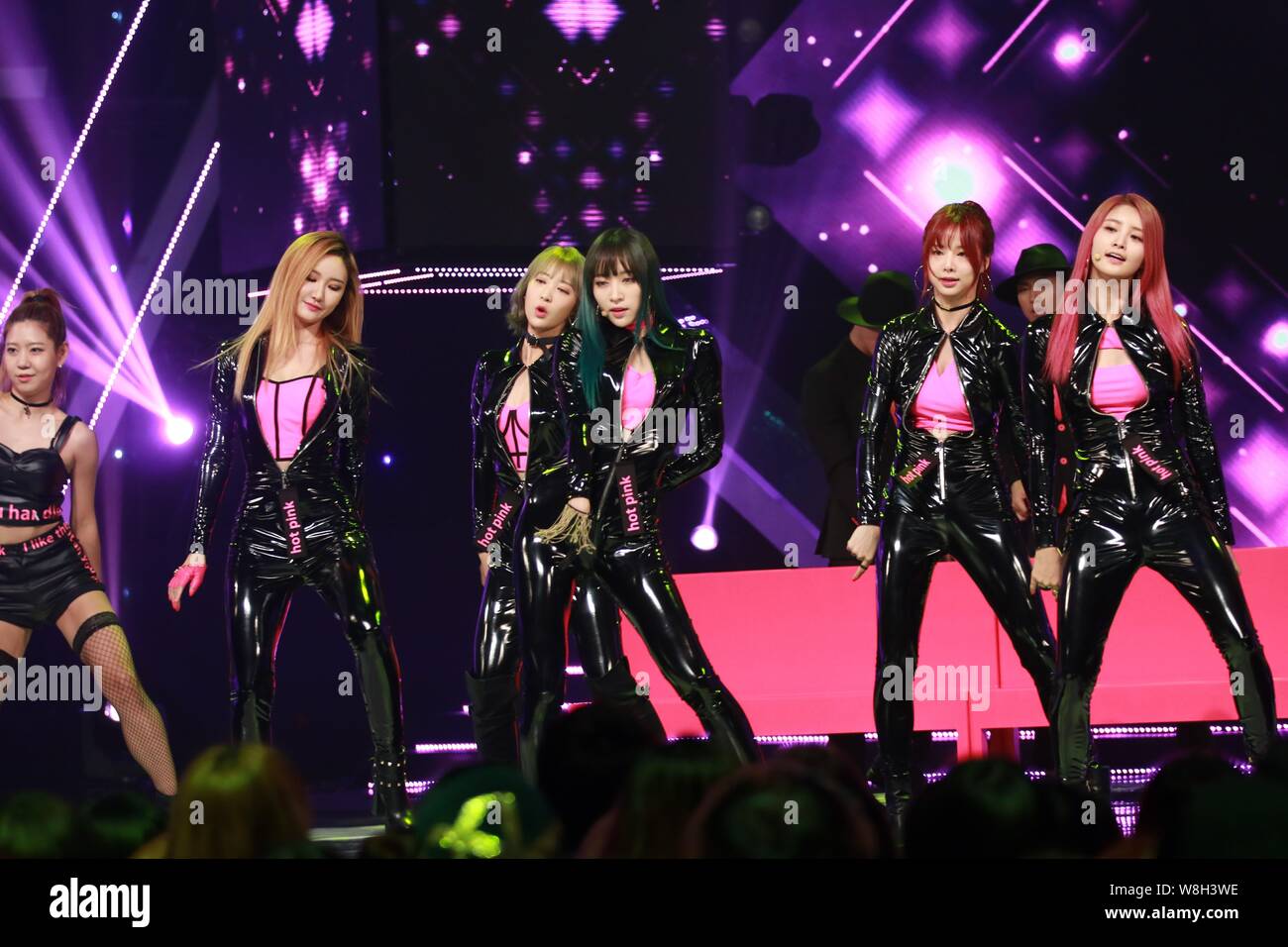 Members of South Korean girl group EXID perform during a filming ...