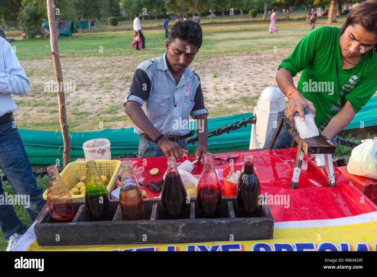 Preparing Chusky, a flavoured crushed ice stick, in India Gate, New ...