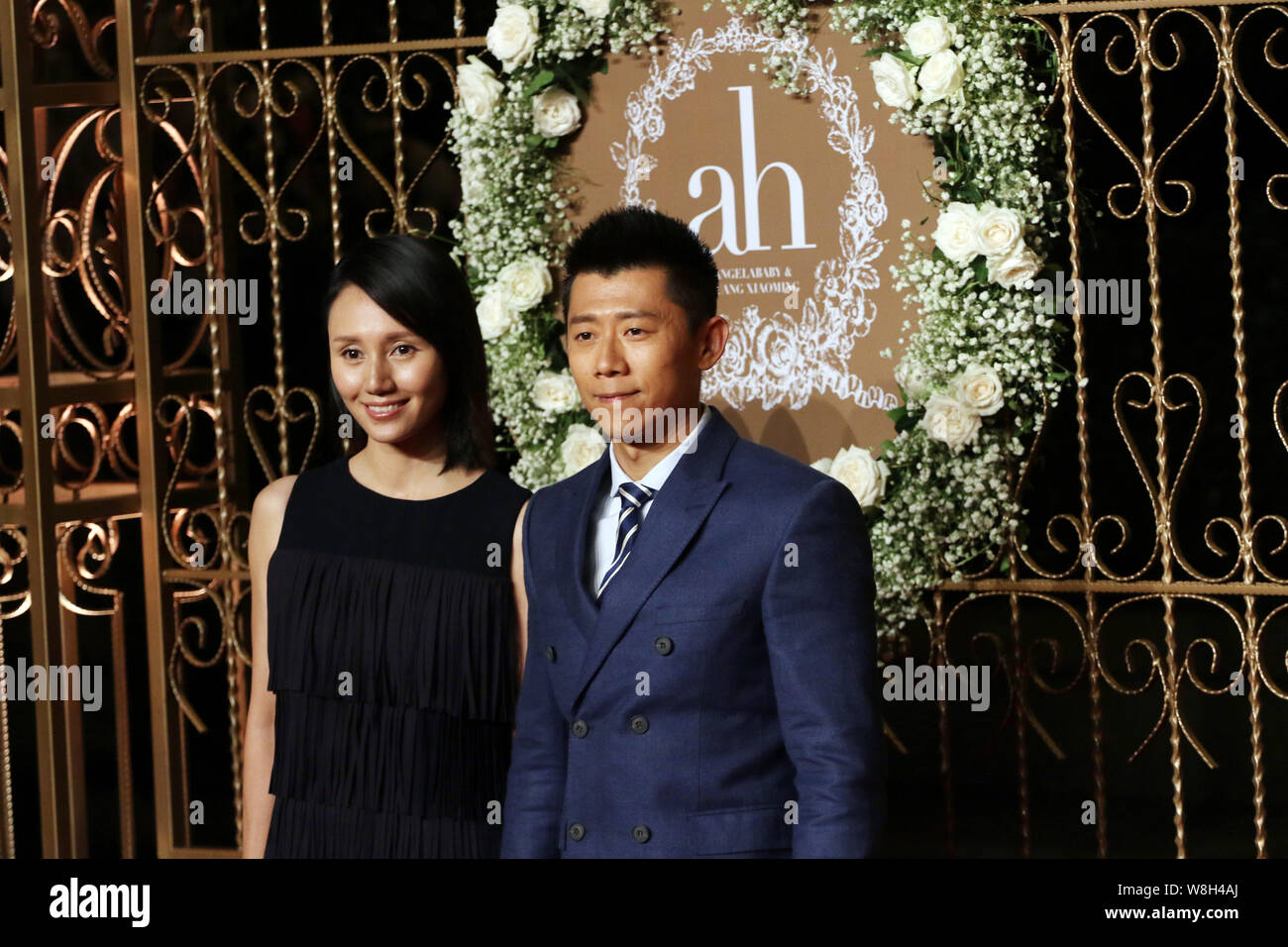 Chinese actor Xia Yu, right, and his actress wife Yuan Quan arrive for ...