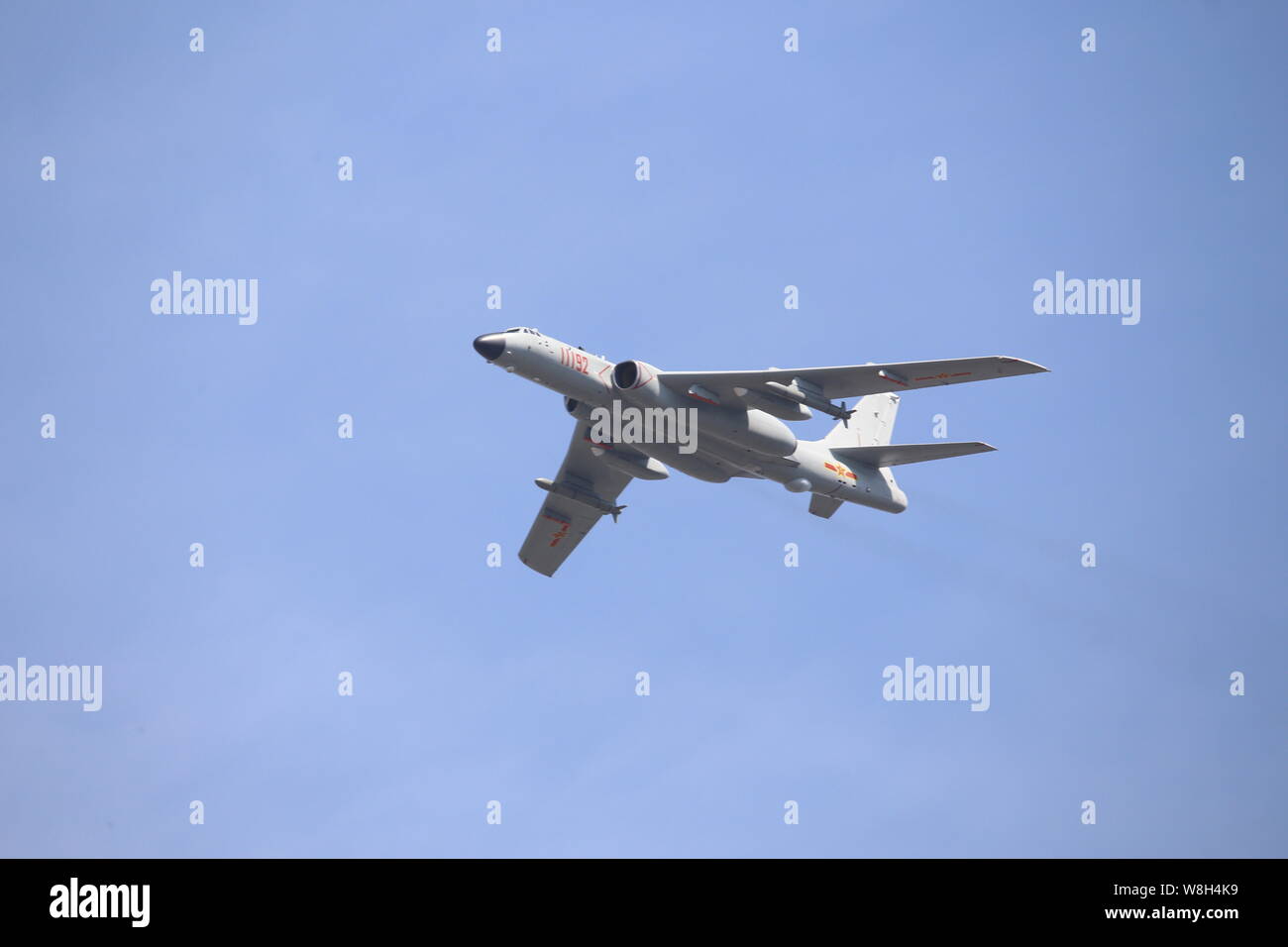 A bomber of PLA's (People's Liberation Army) Air Force flies over ...