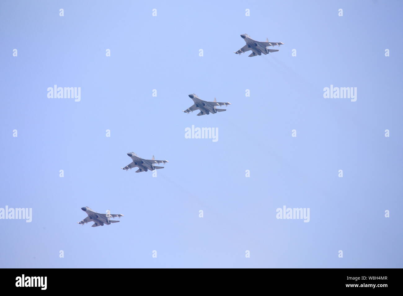 J-11 fighter jets fly in formation over Tiananmen Square during the ...
