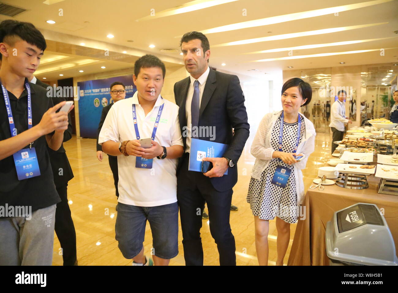 Portuguese football star Luis Figo, second right, is pictured during ...