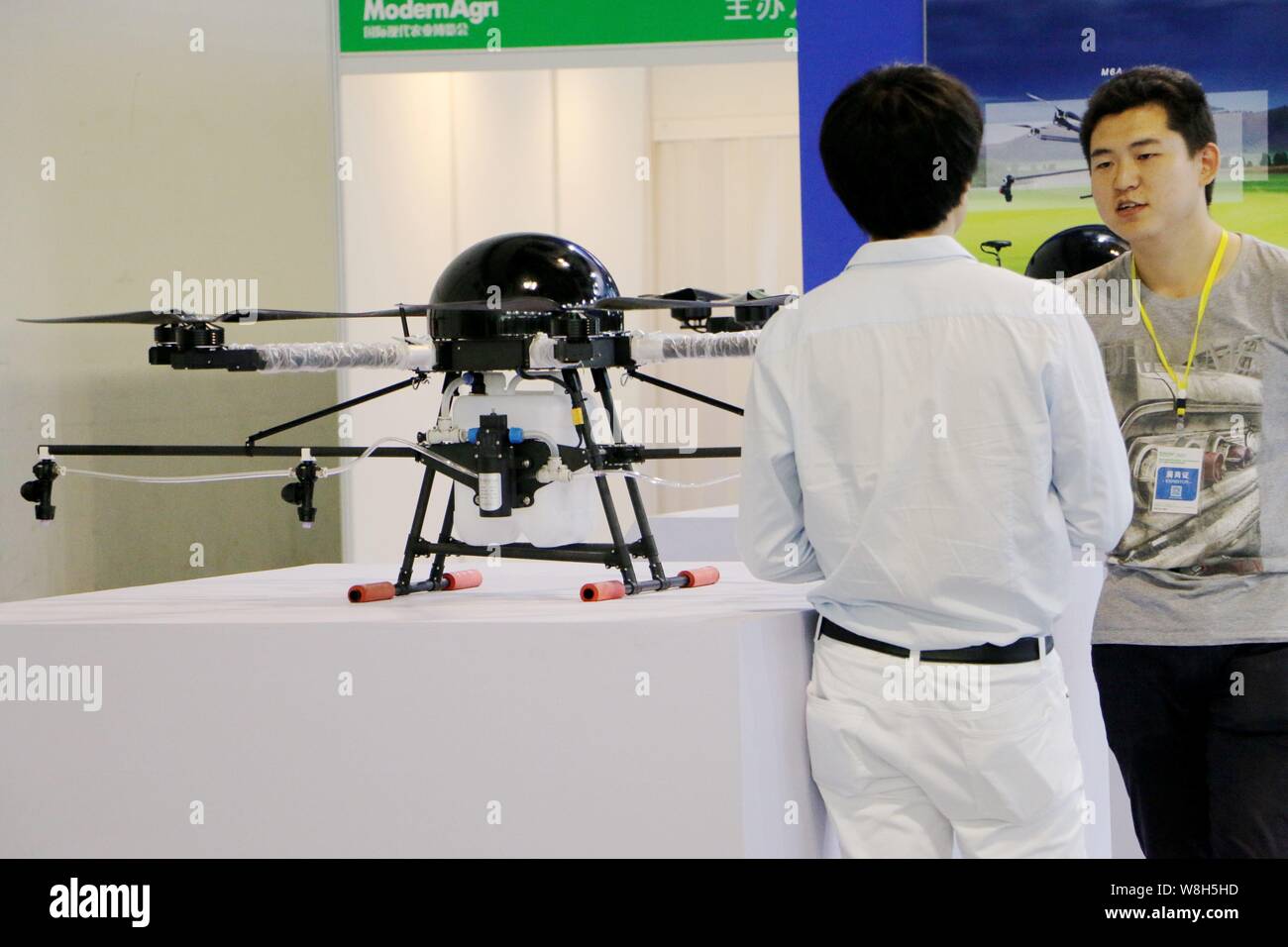 --FILE--An exhibitor of unmanned aerial vehicles (UAV) or drones talks ...
