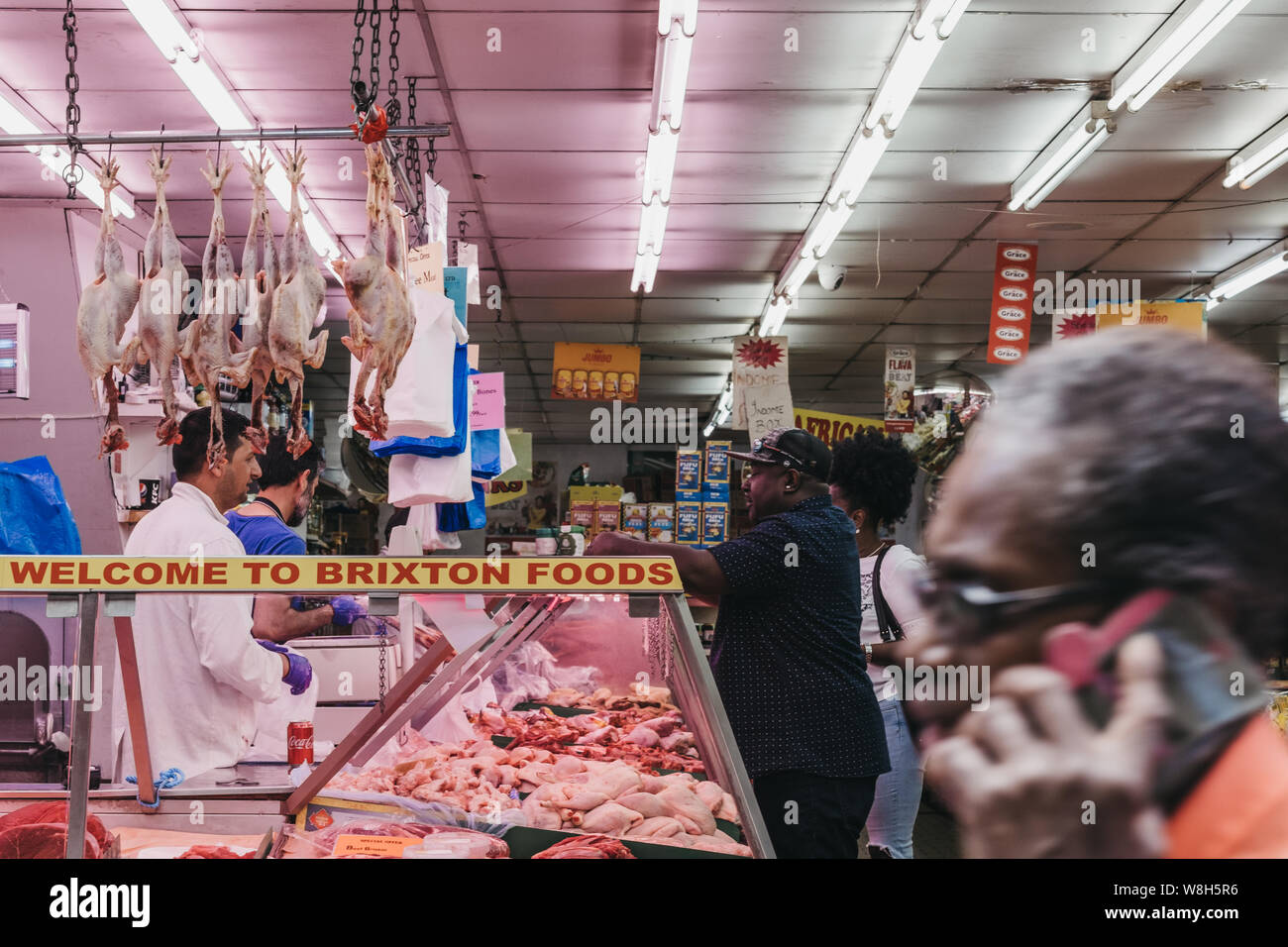 London, UK - July 16, 2019: Seller and customer at Brixton Foods Store ...