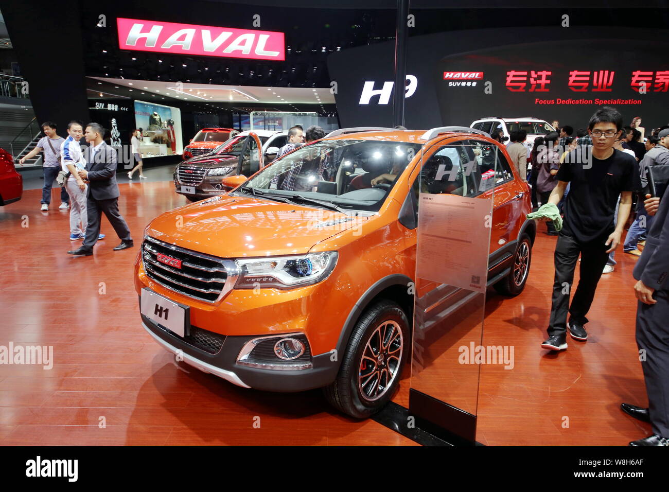 --FILE--Visitors look at or try out Haval H1 and other SUVs of Great ...