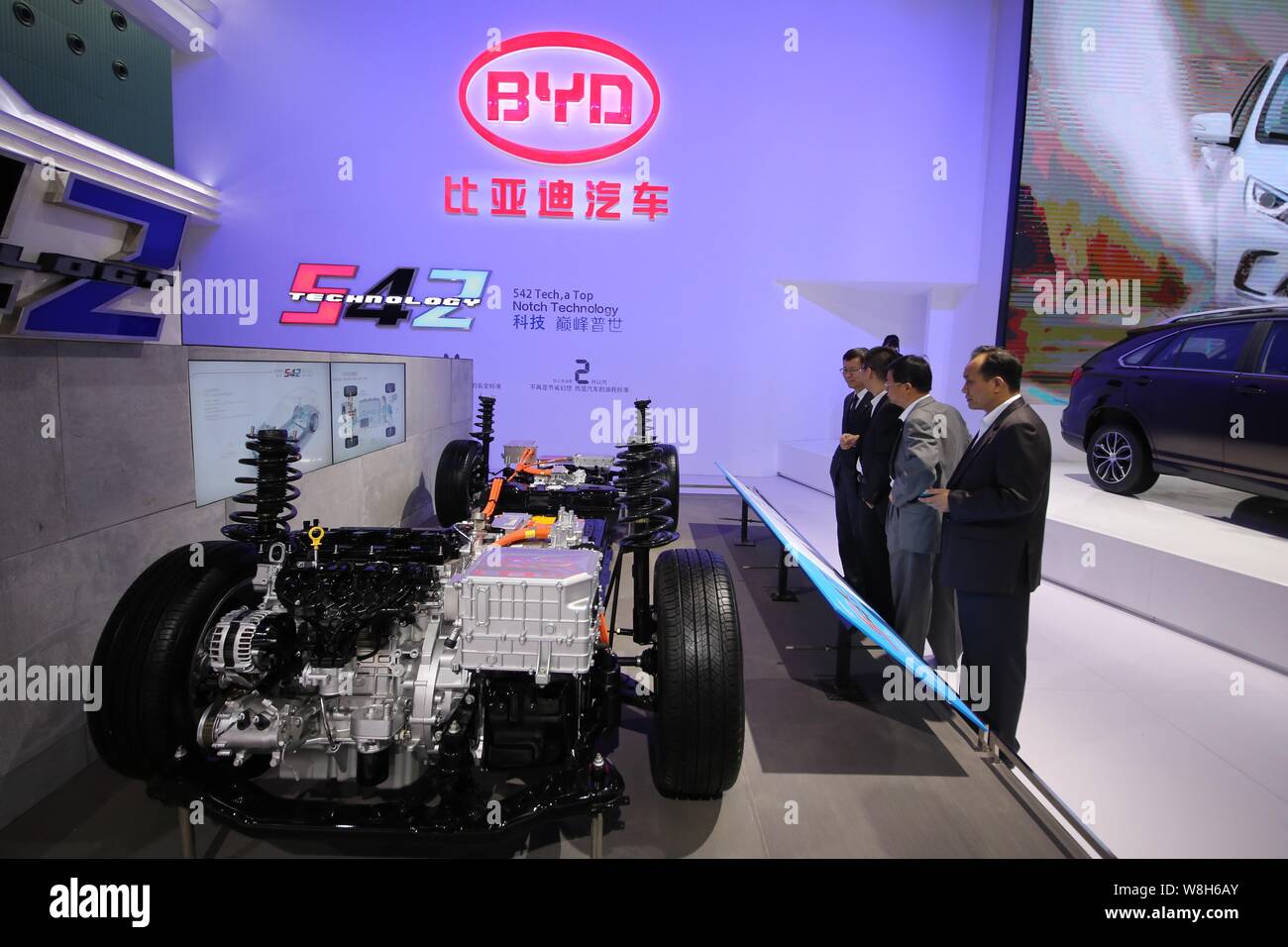--FILE--Visitors look at a model of a BYD car during the 12th China ...
