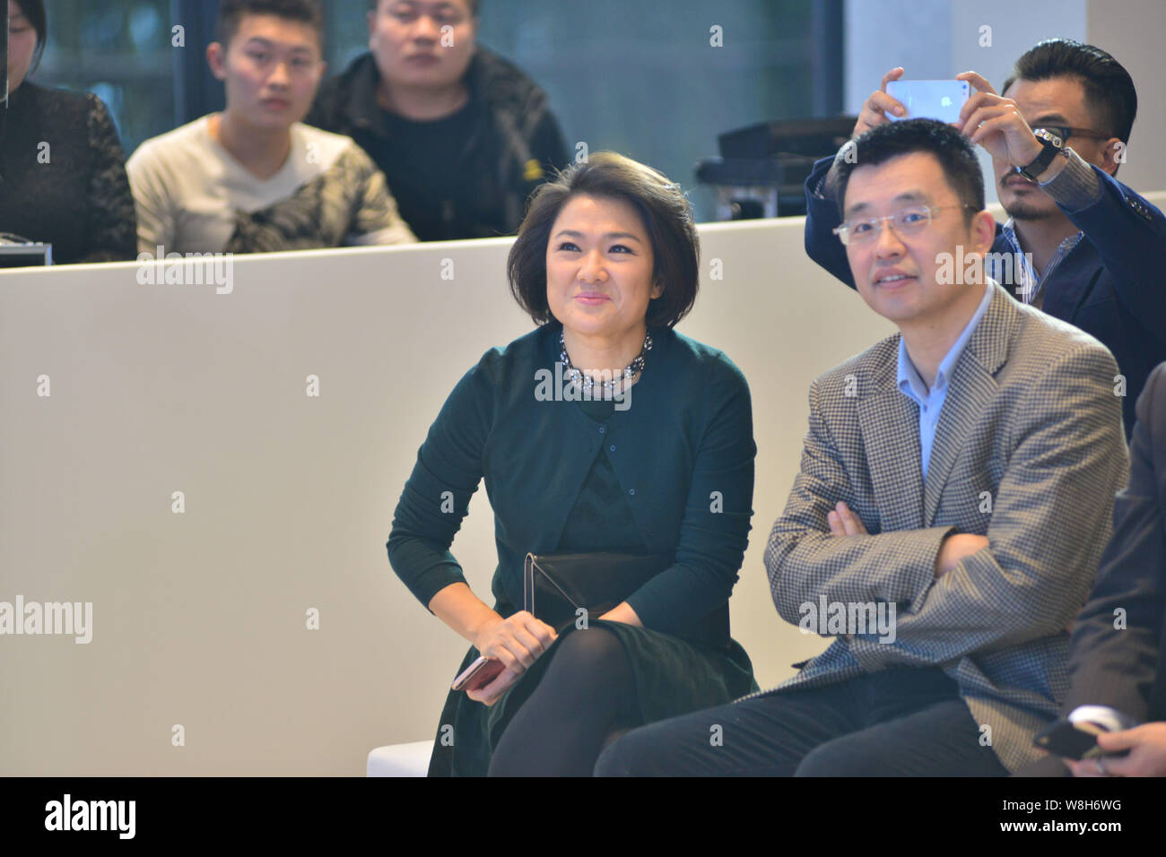 Zhang Xin, left, co-founder, co-CEO of SOHO China and wife of Pan Shiyi, attends the opening ...