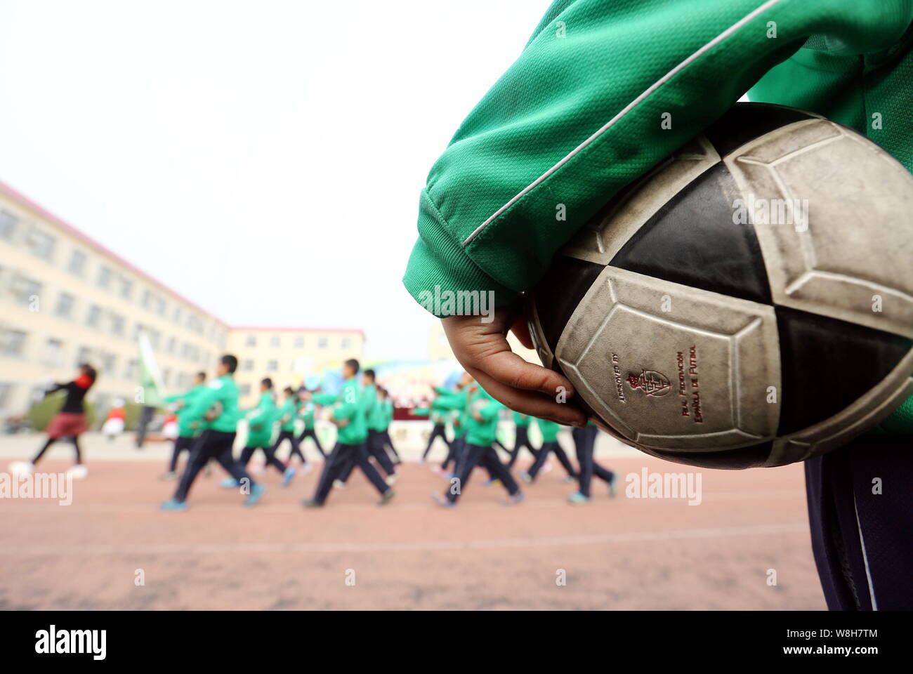 Young Chinese students parade at the opening ceremony for the Fourth ...