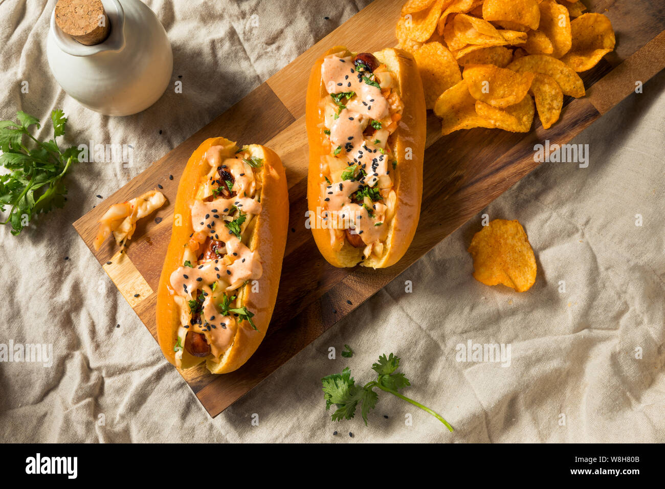 Homemade Korean Kimchi Hot Dogs with Sriracha and Sesame Seeds Stock ...