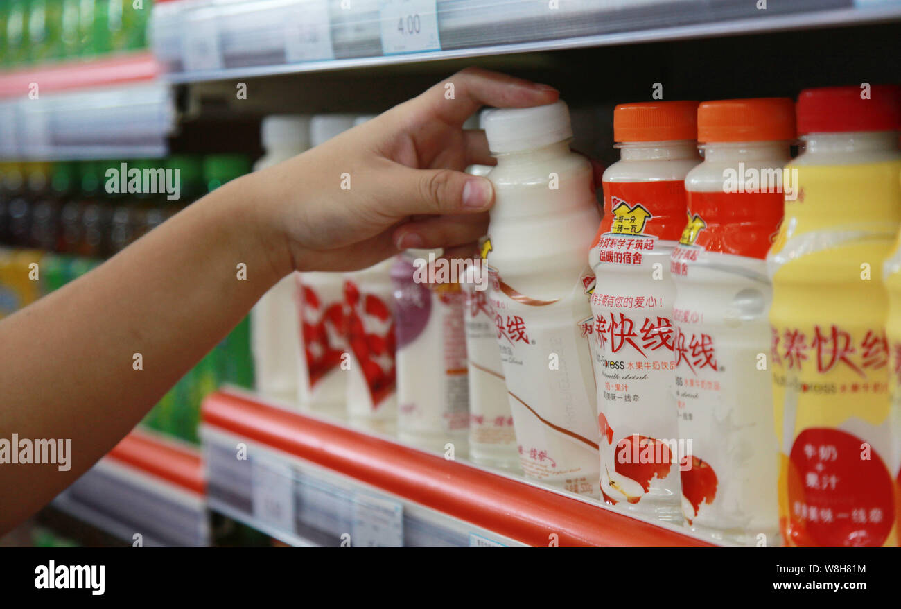 --FILE--A customer buys a bottle of Nutri-Express milk juice of Wahaha ...