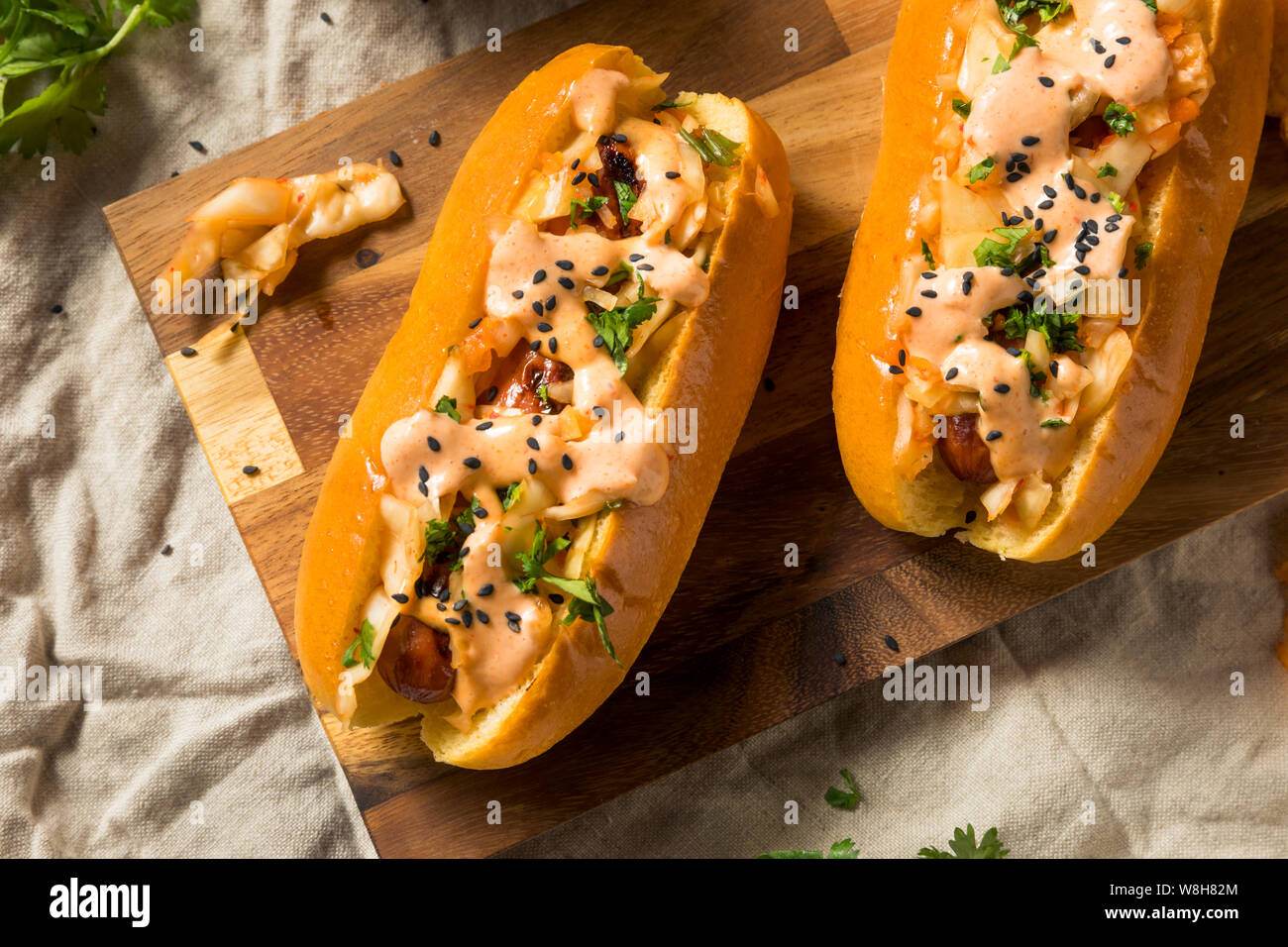 Homemade Korean Kimchi Hot Dogs with Sriracha and Sesame Seeds Stock ...