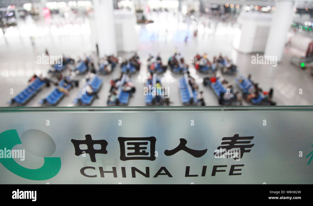 --FILE--A signboard of China Life Insurance Company is pictured at the ...