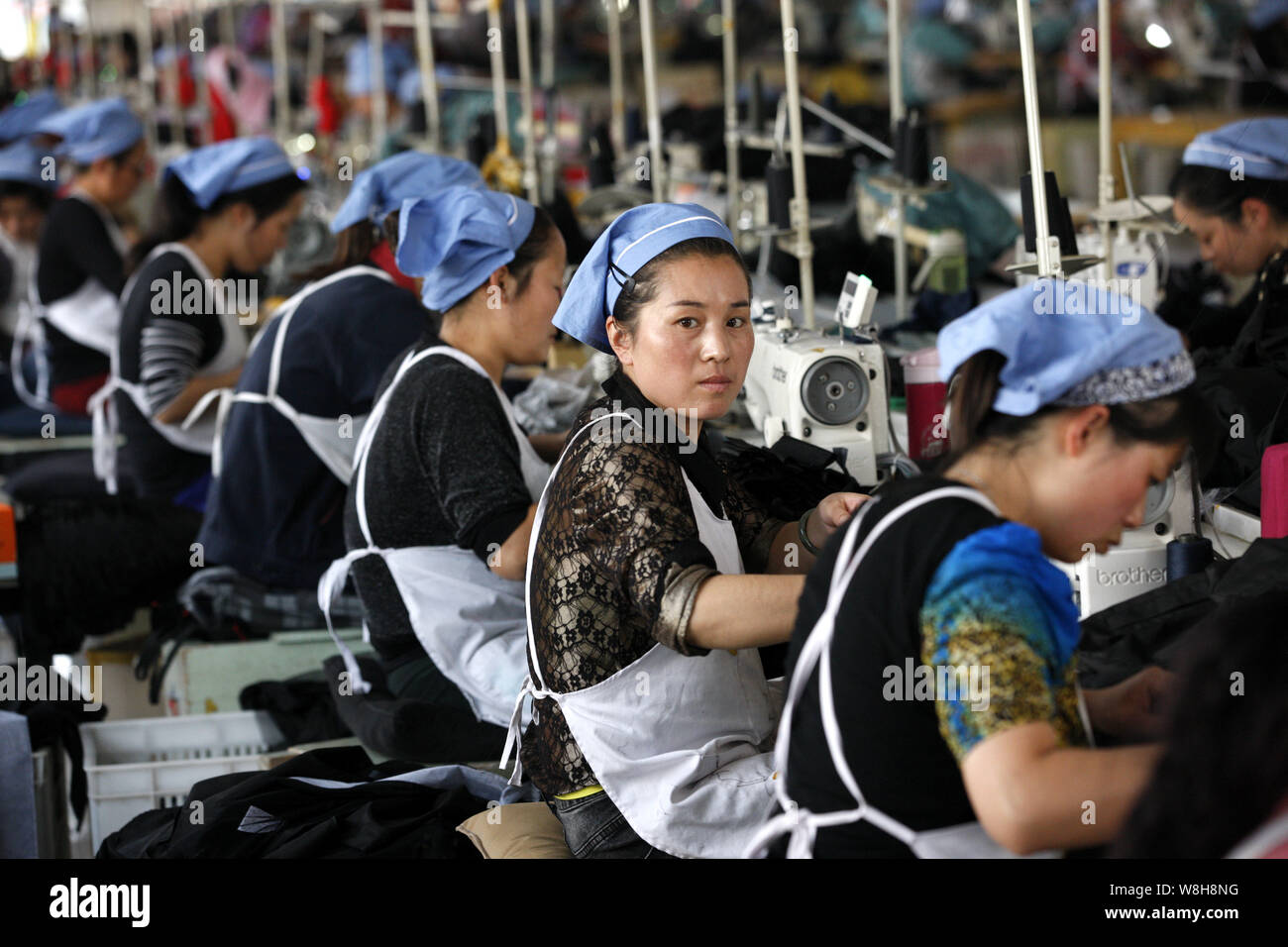Garment factory workers 2015 hi-res stock photography and images - Alamy