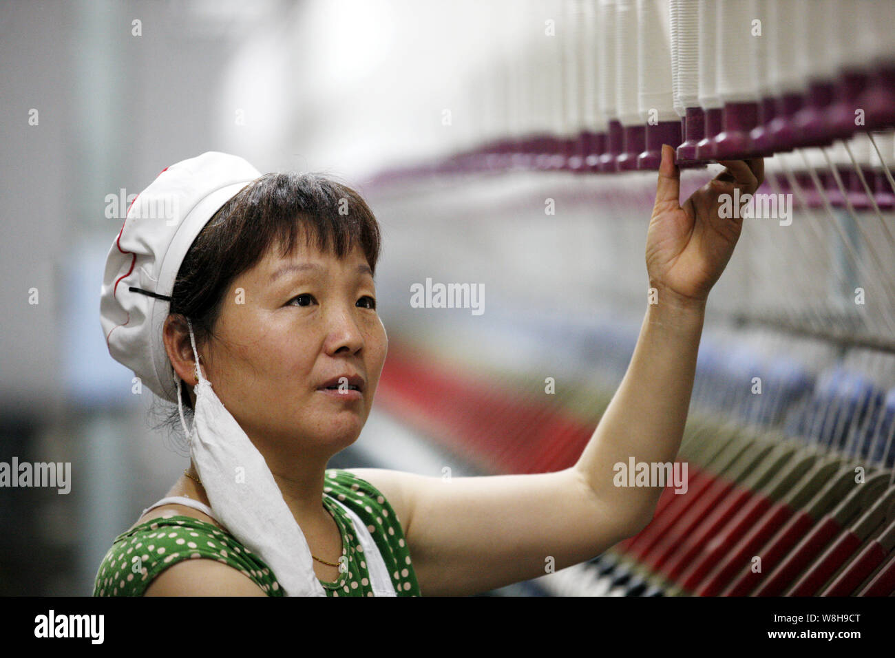 Chinese female factory worker hi-res stock photography and images - Alamy