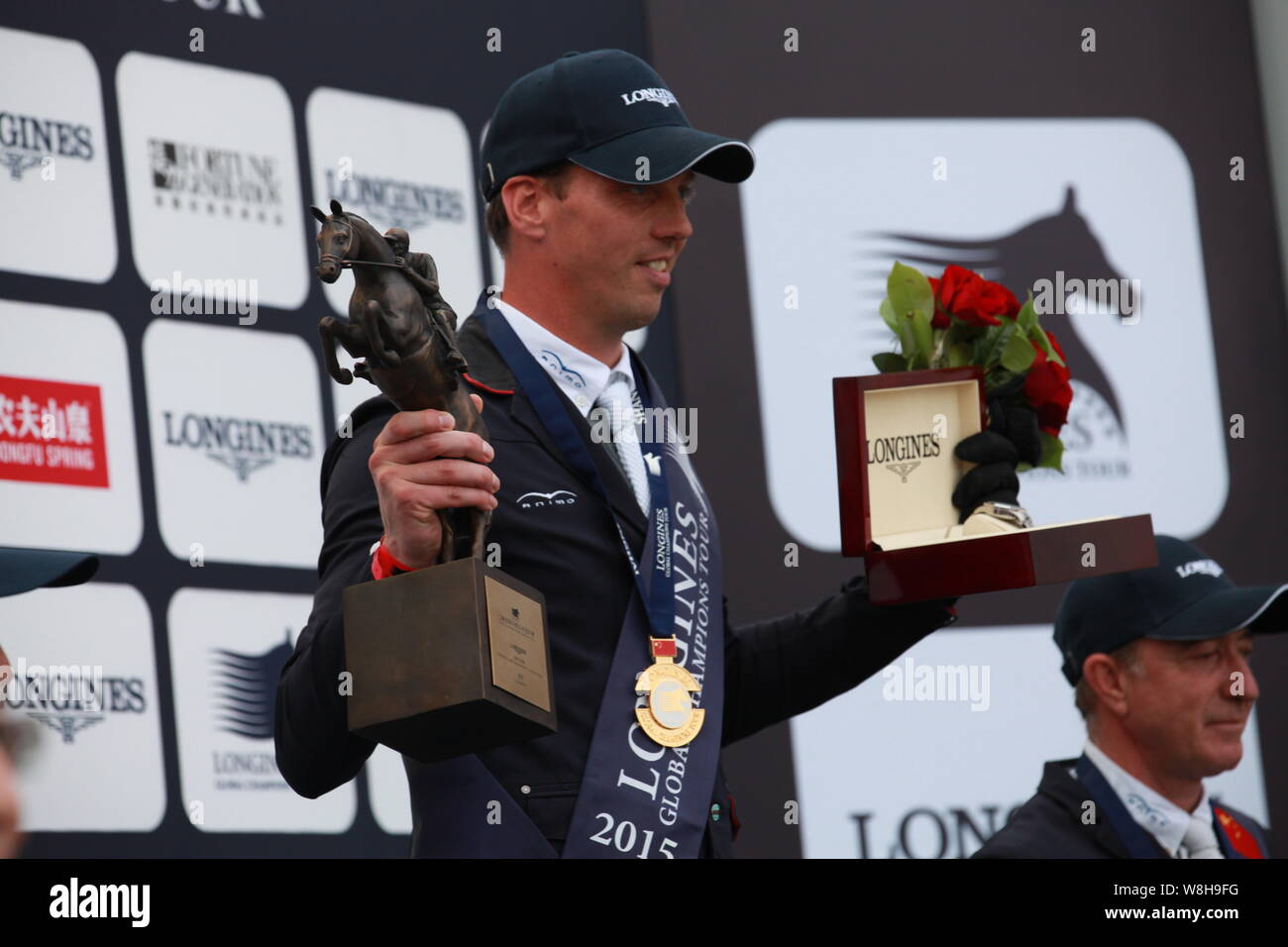 Dutchman equestrian rider Harrie Smolders poses with his trophy after ...