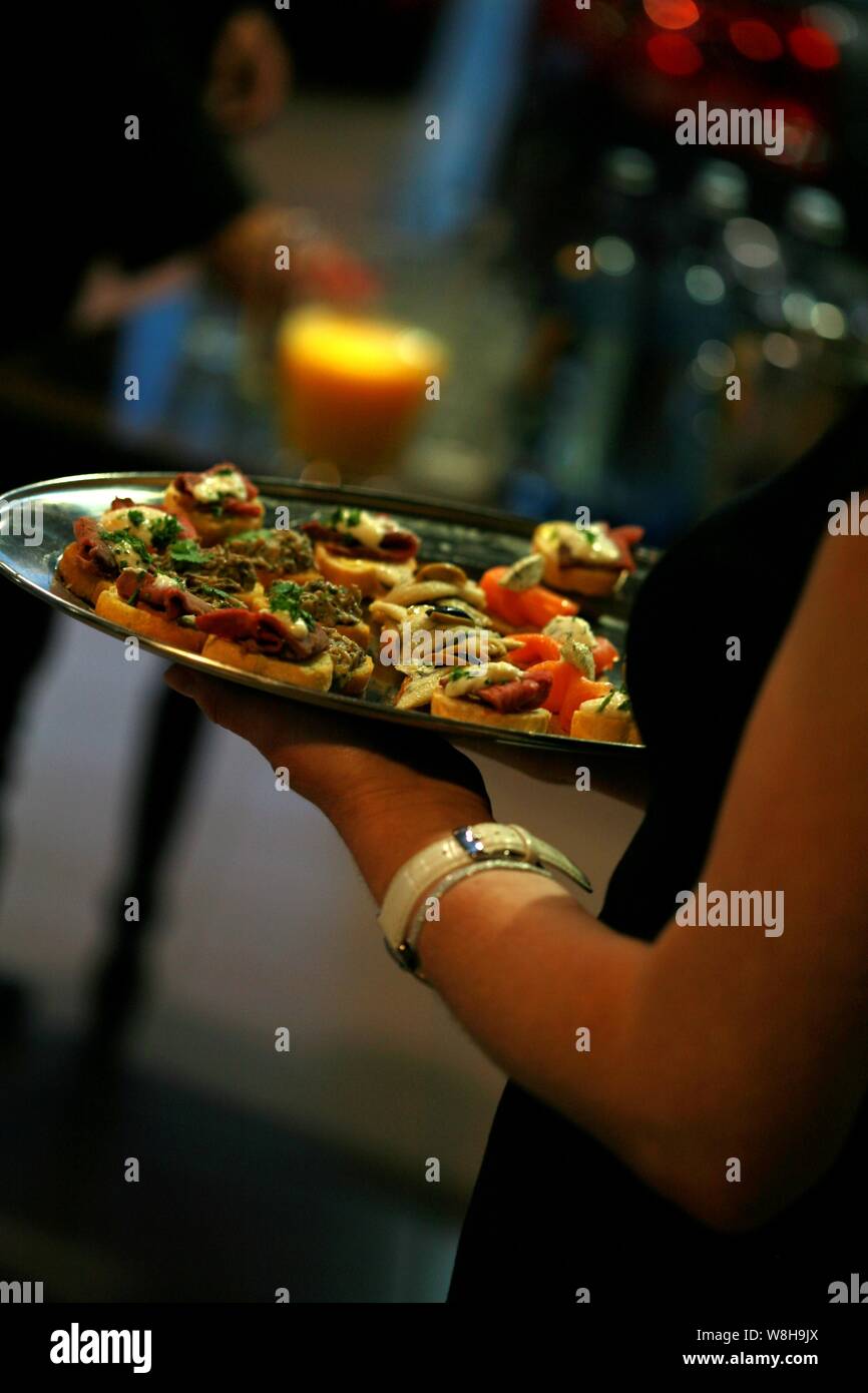 Waitress serving canapes hi-res stock photography and images - Alamy