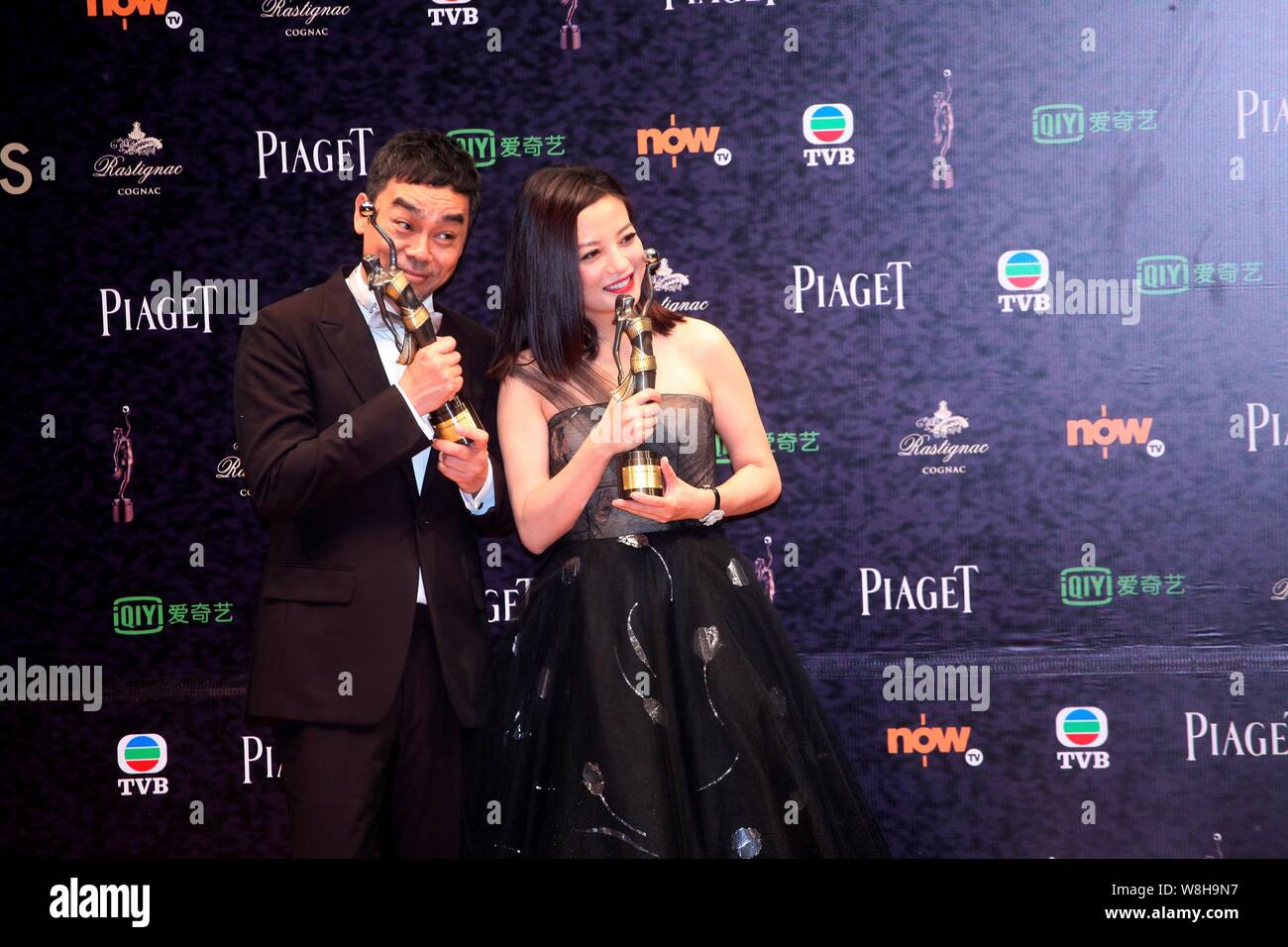 Chinese actress Zhao Wei, right, and Hong Kong actor Sean Lau pose with ...