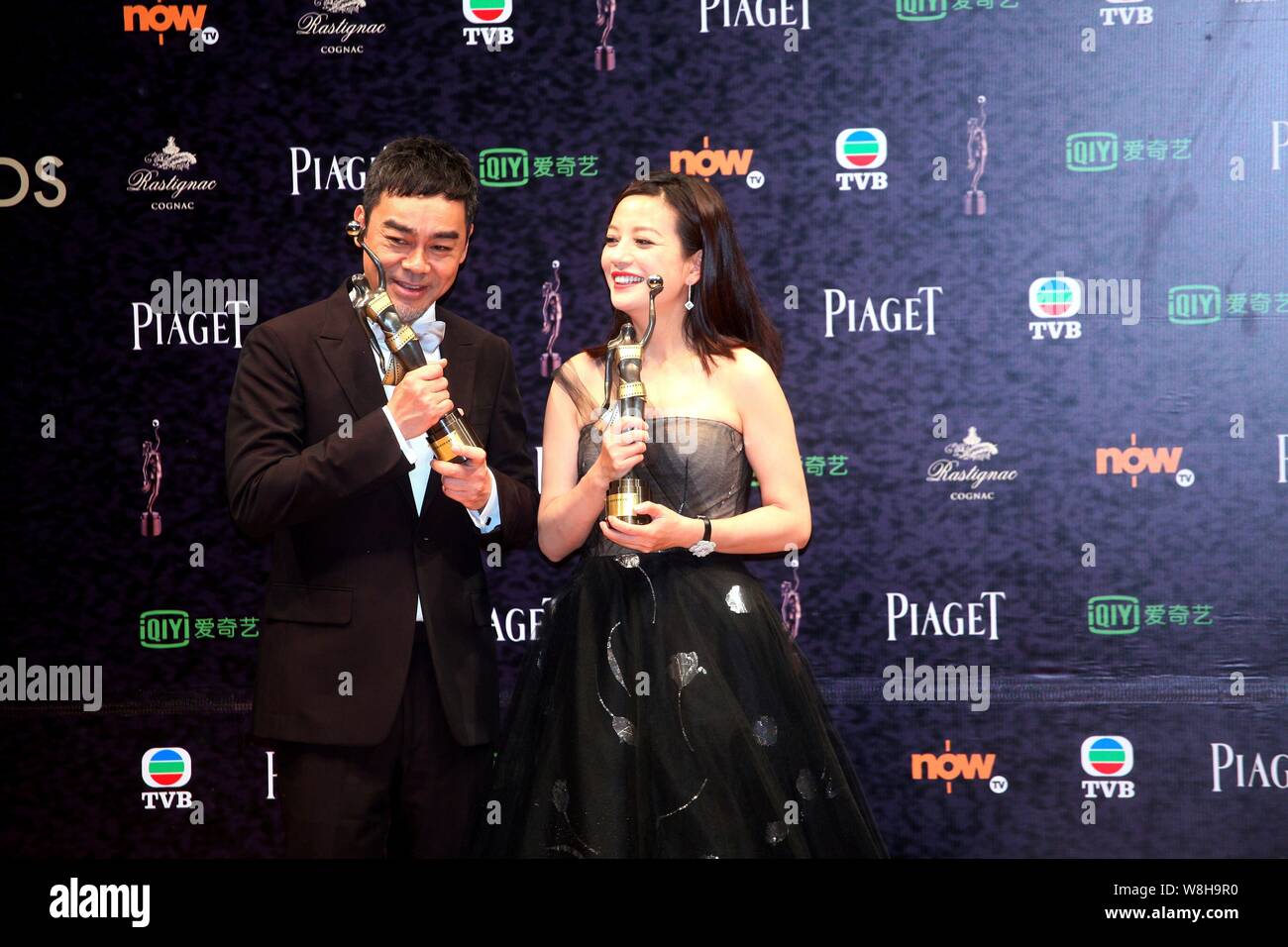 Chinese actress Zhao Wei, right, and Hong Kong actor Sean Lau pose with ...