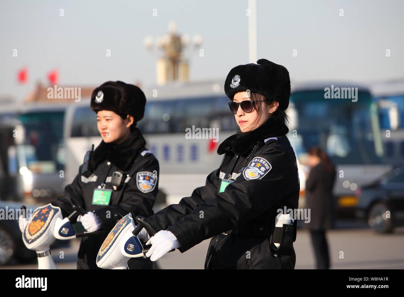 Female police officers drive Segway-like two-wheeled electric vehicles ...