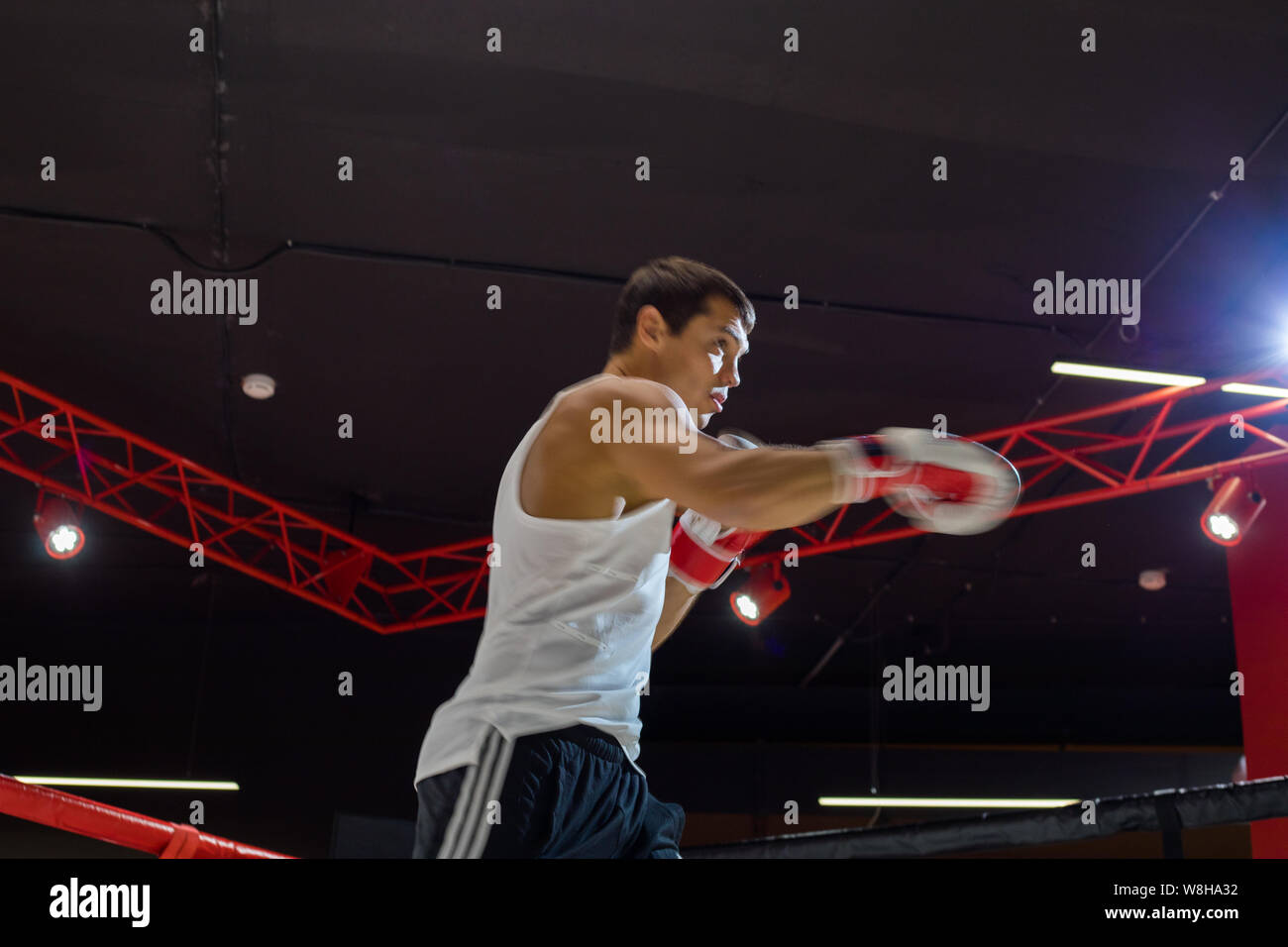 CHELYABINSK, RUSSIA - June 8, 2019: Male boxer is training in the ring ...