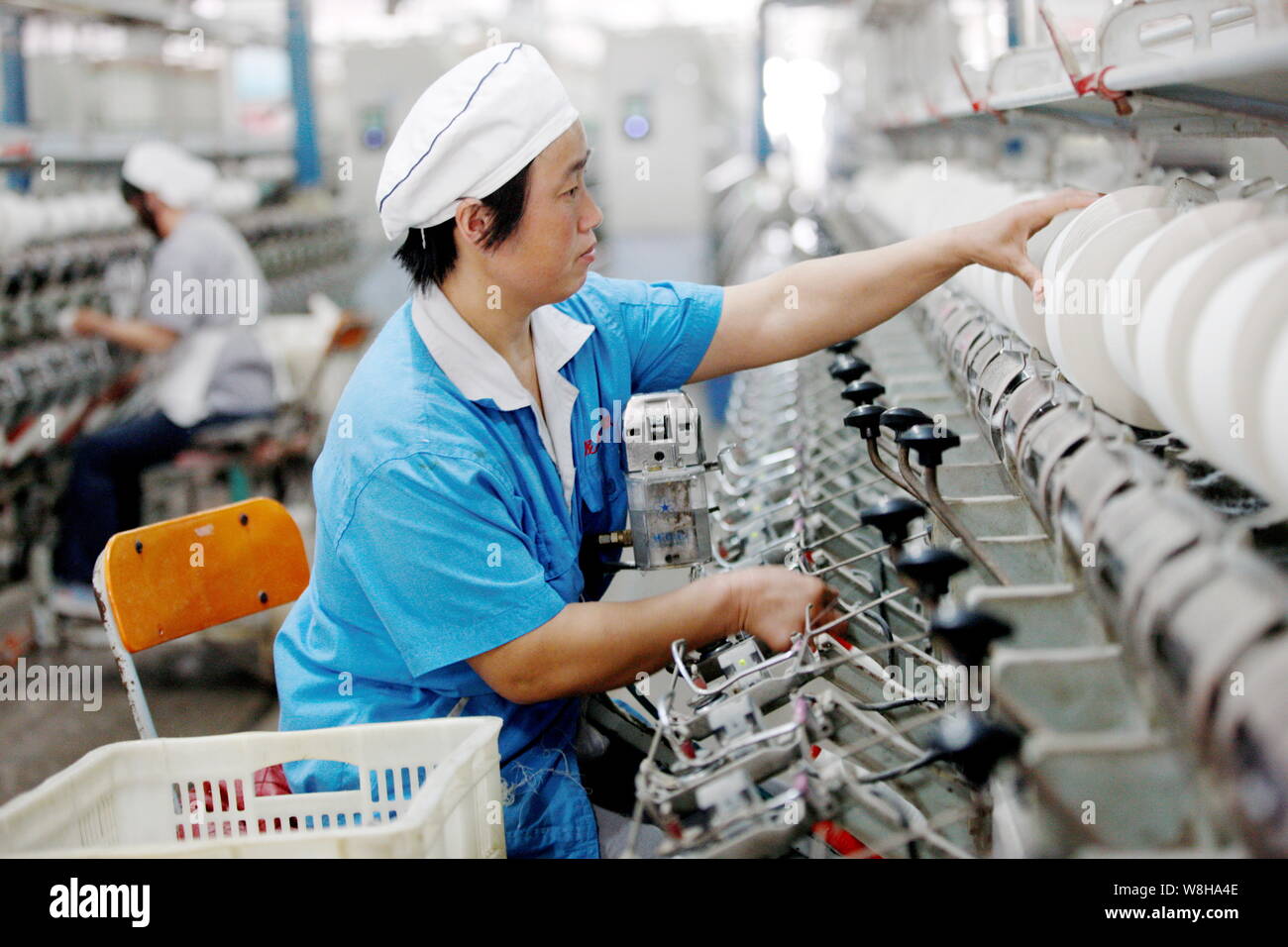 --FILE--Female Chinese workers handle production of textile products to be exported to South ...