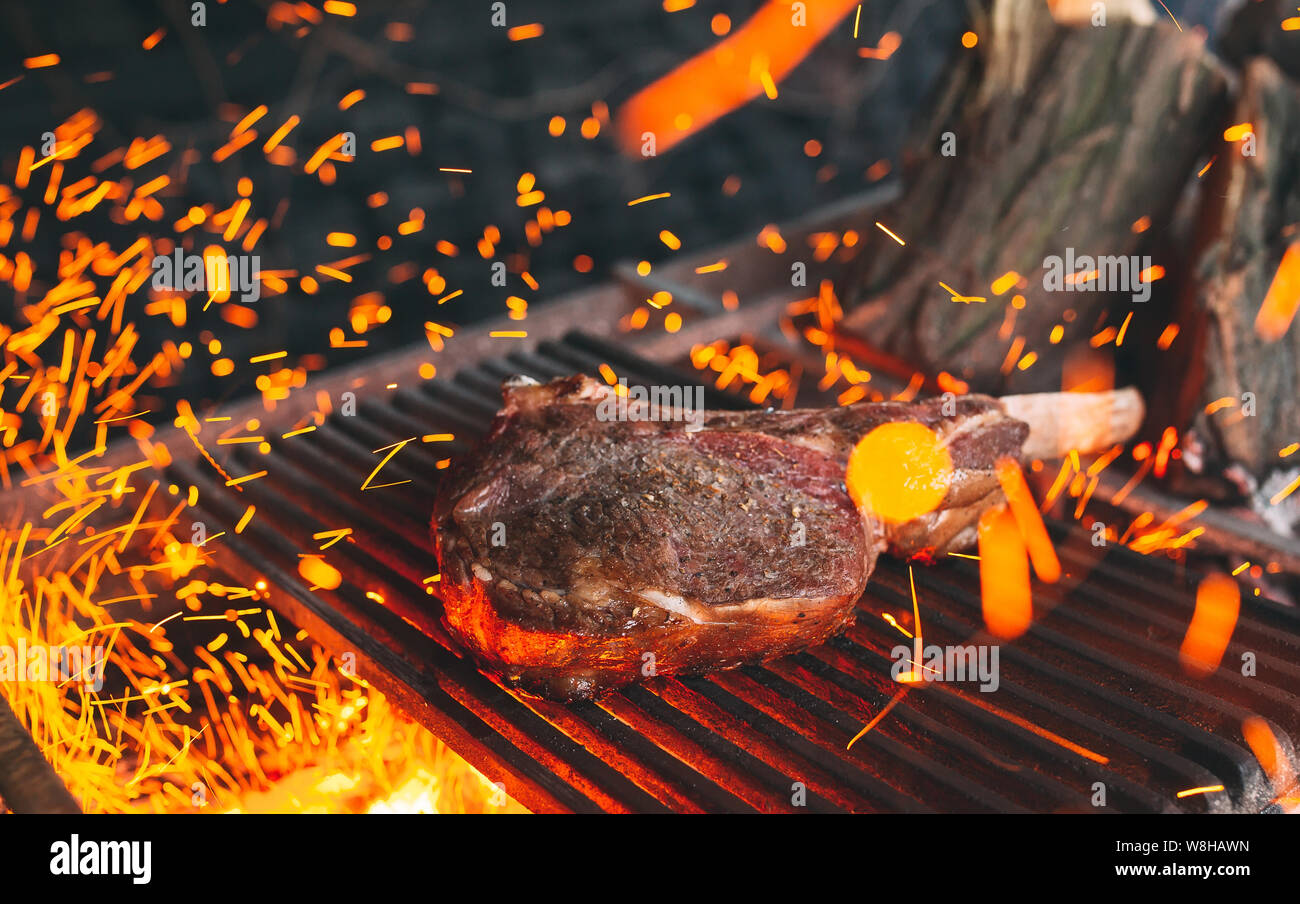 Beef steak is cooked on fire. Beef Rib BBQ Stock Photo - Alamy