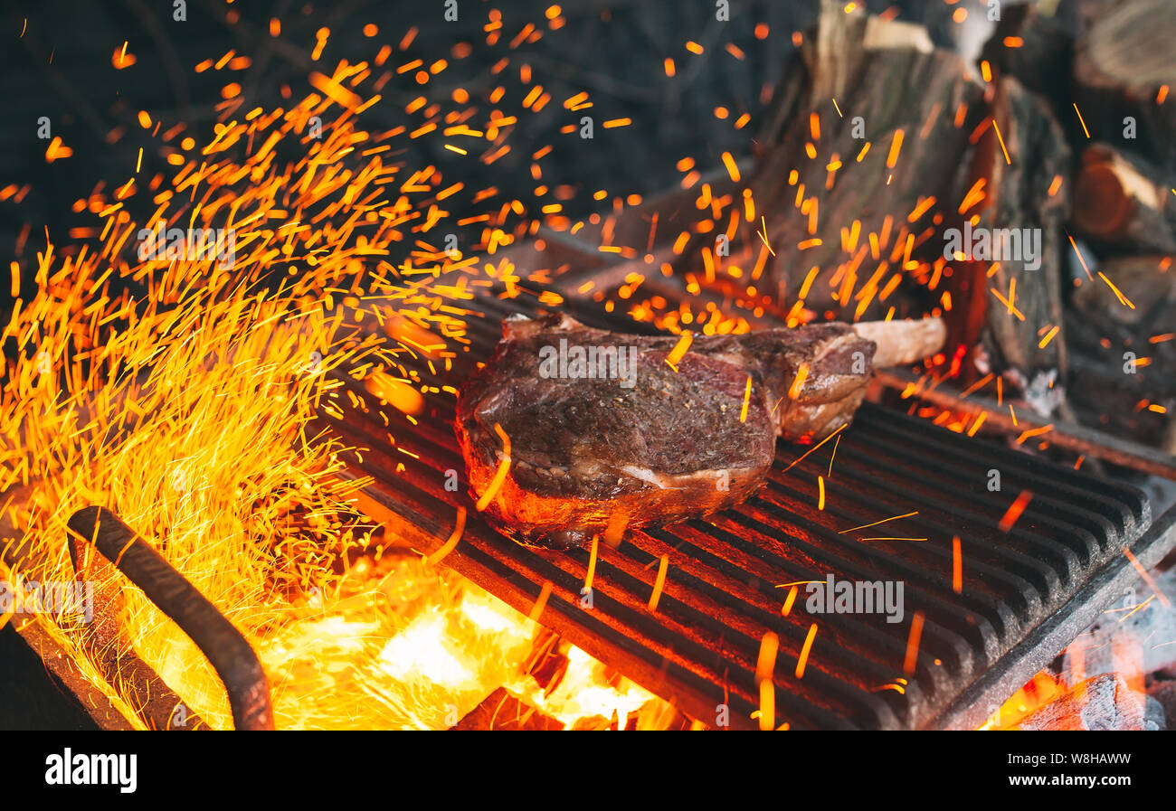 Beef steak is cooked on fire. Beef Rib BBQ Stock Photo - Alamy