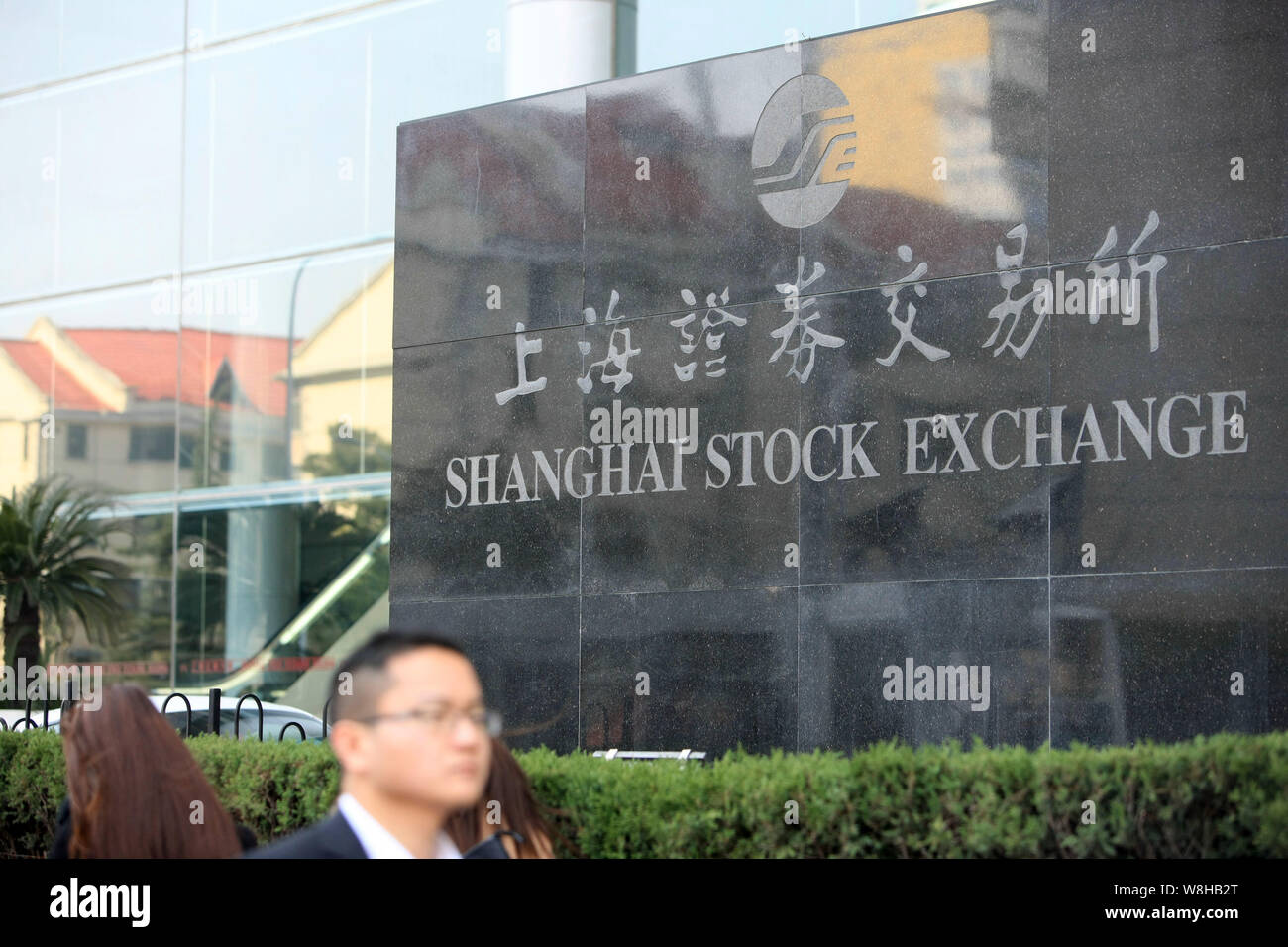 --FILE--Pedestrians walk past the Shanghai Stock Exchange Building in ...