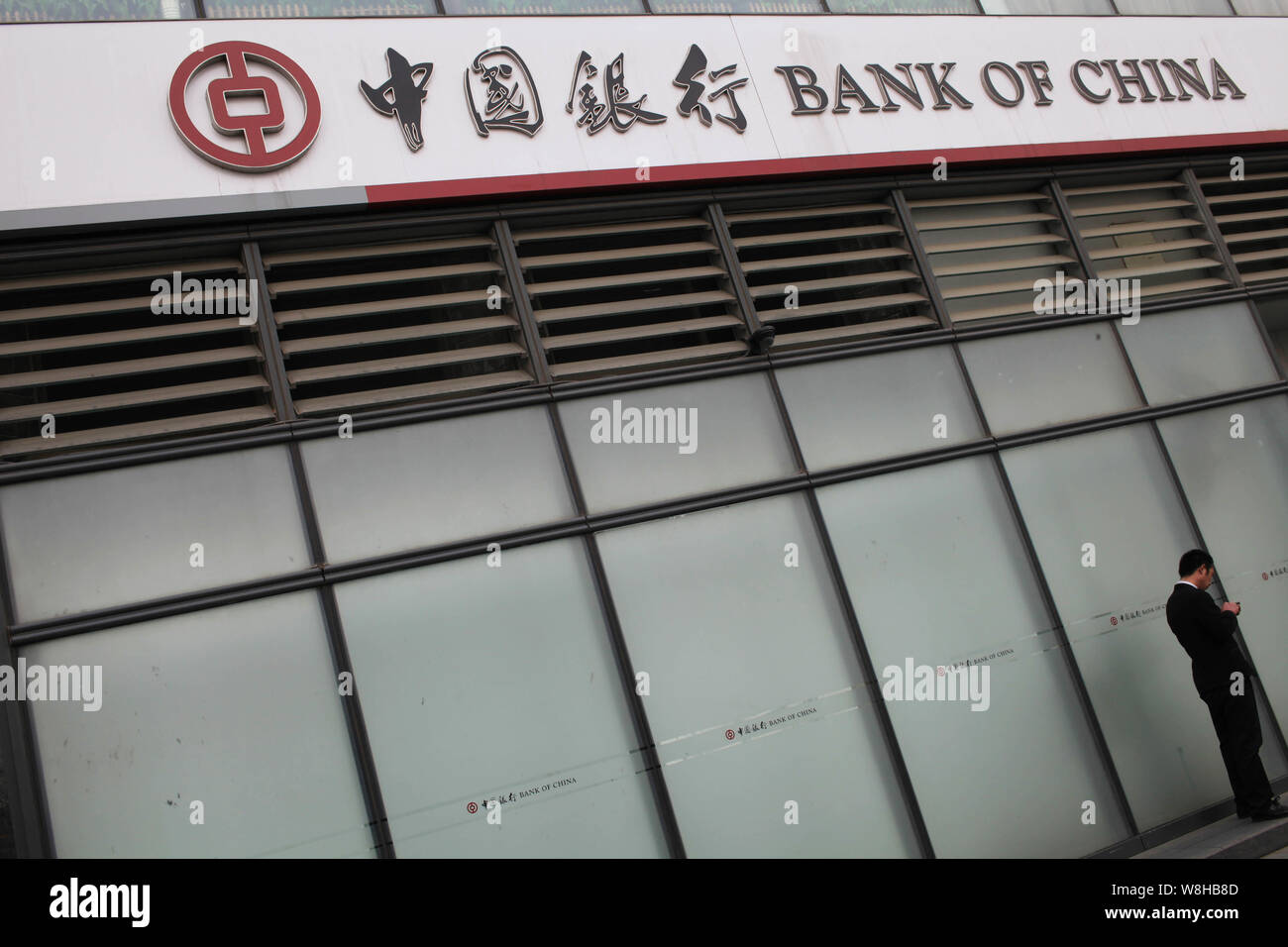 --FILE--A pedestrian stands in front of a branch of Bank of China (BOC ...