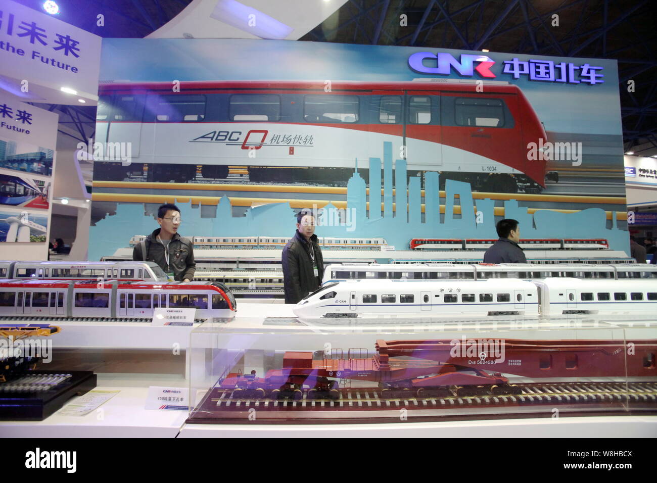 --FILE--Chinese visitors look at models of CRH (China Railway High ...